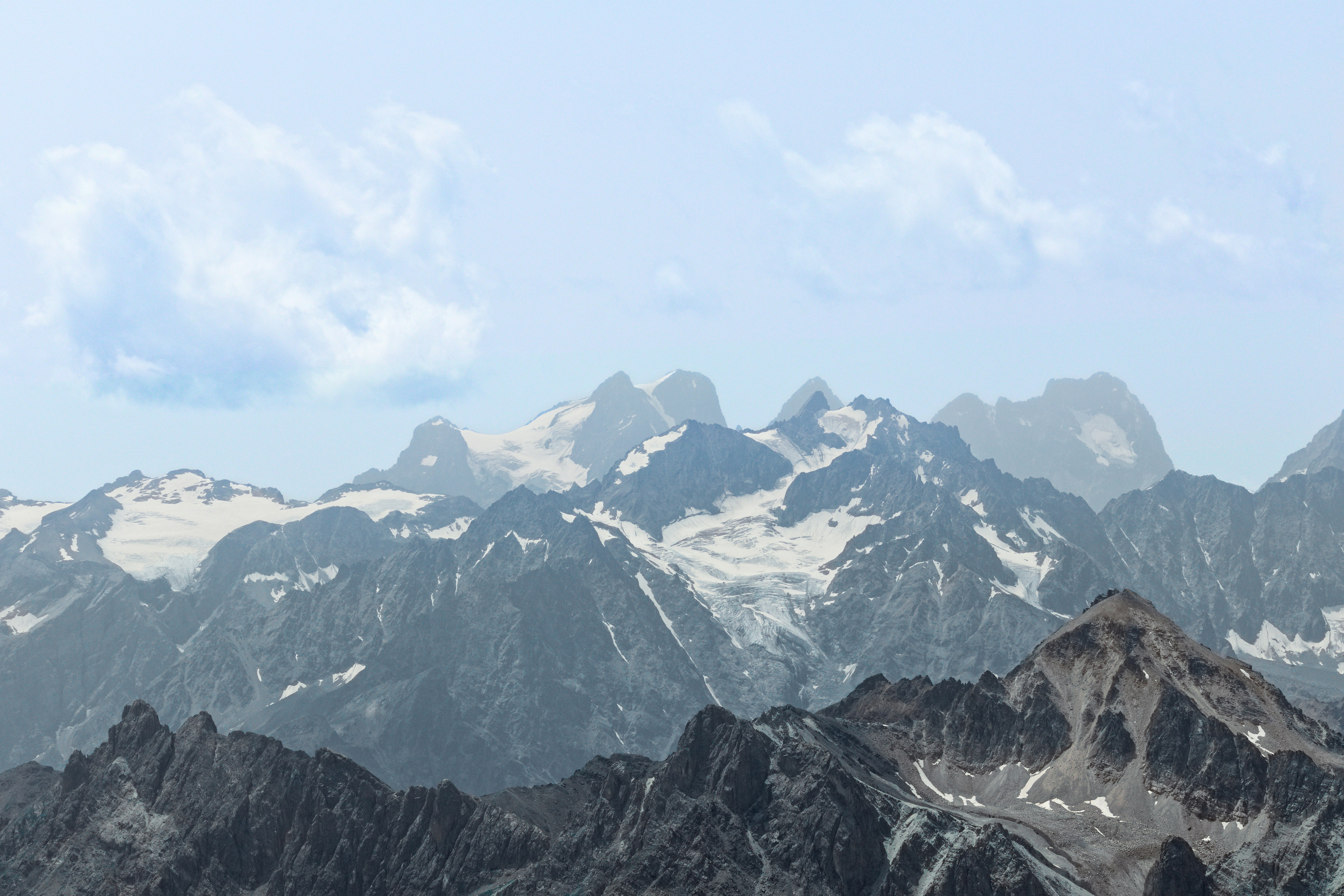Edge of the World: Snow-capped Peaks Emerging from Dark Basalt