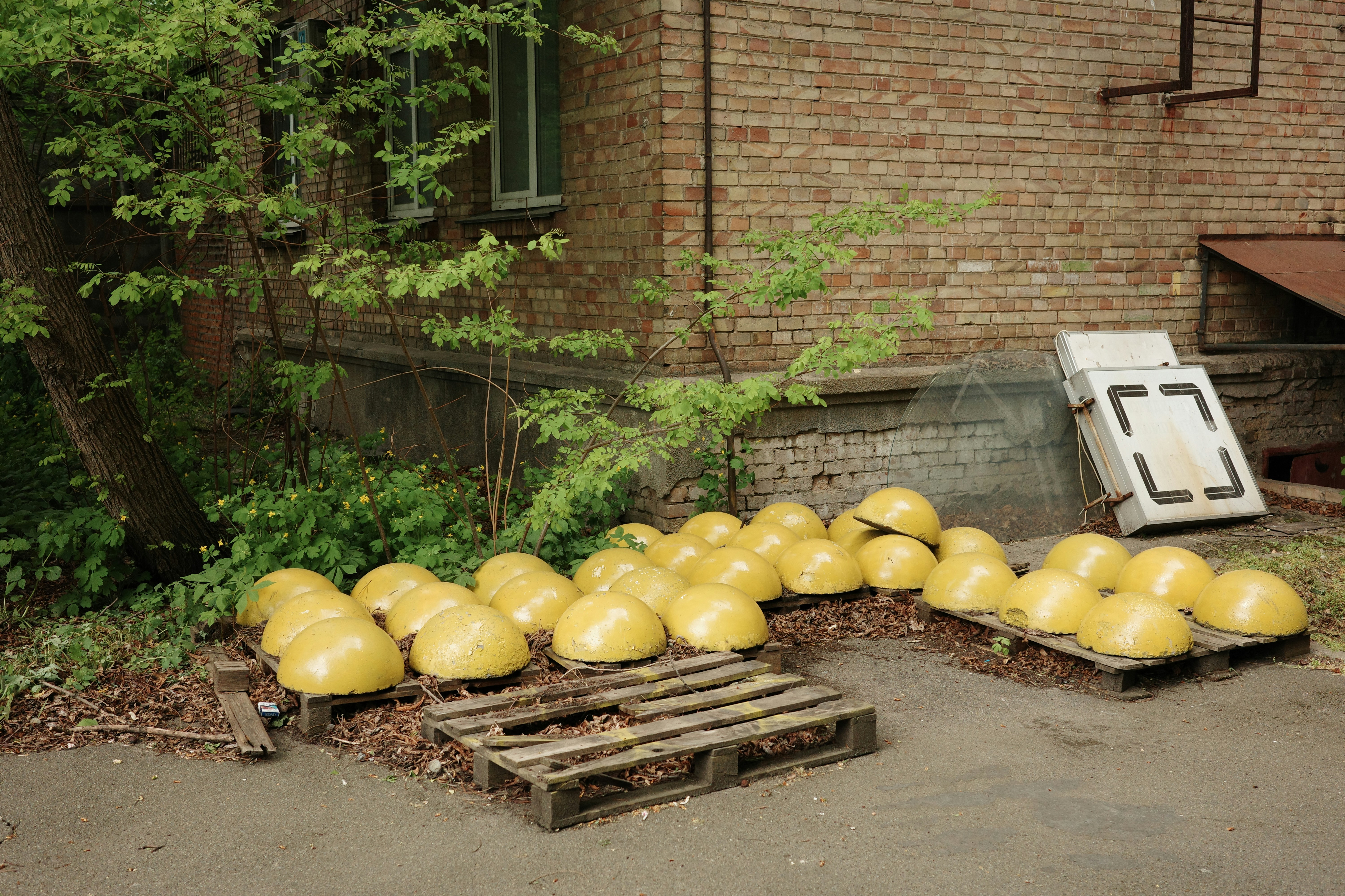 Yellow domes by the brick wall