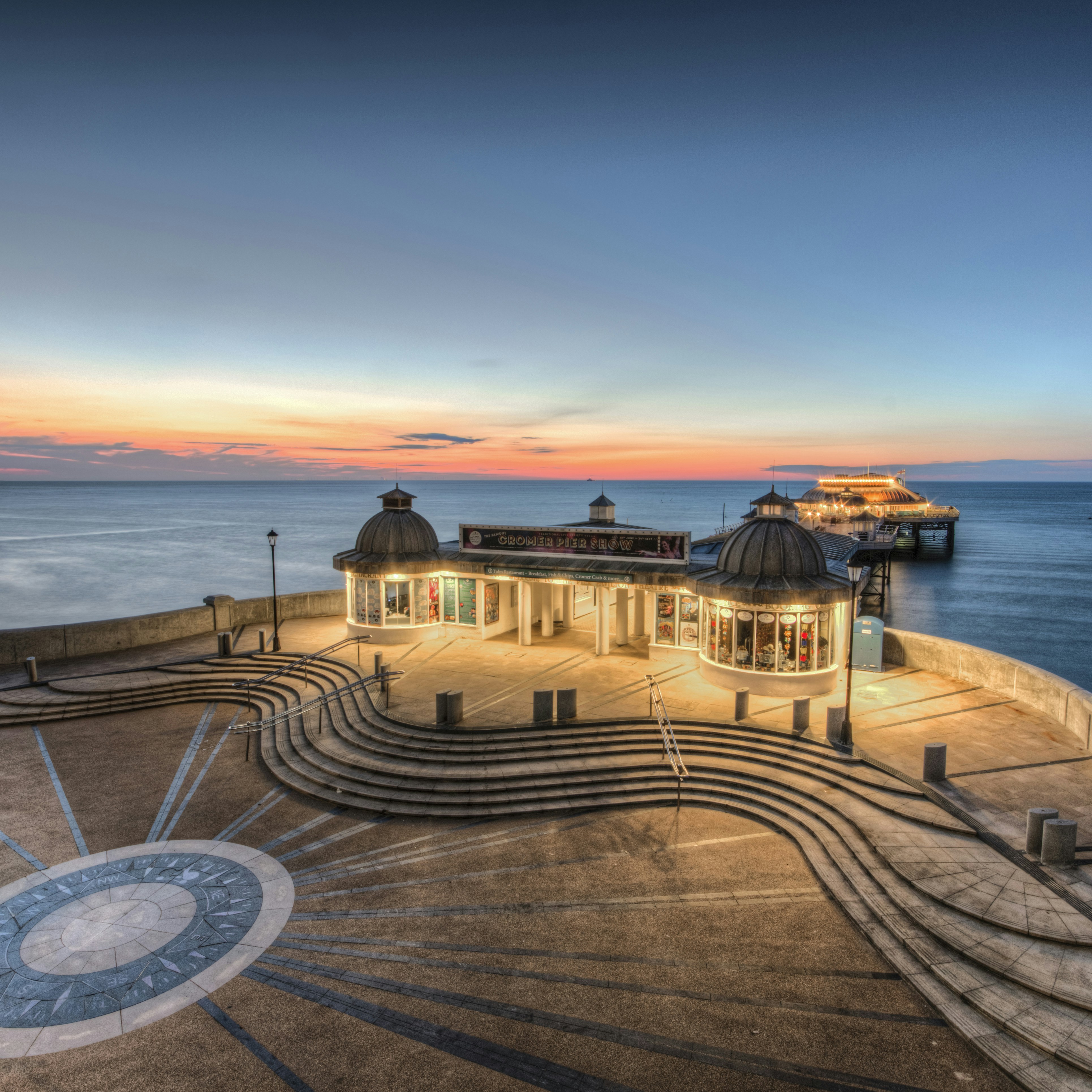 Curved Terrace at Sea Gate: A Sunset-Soaked Pier