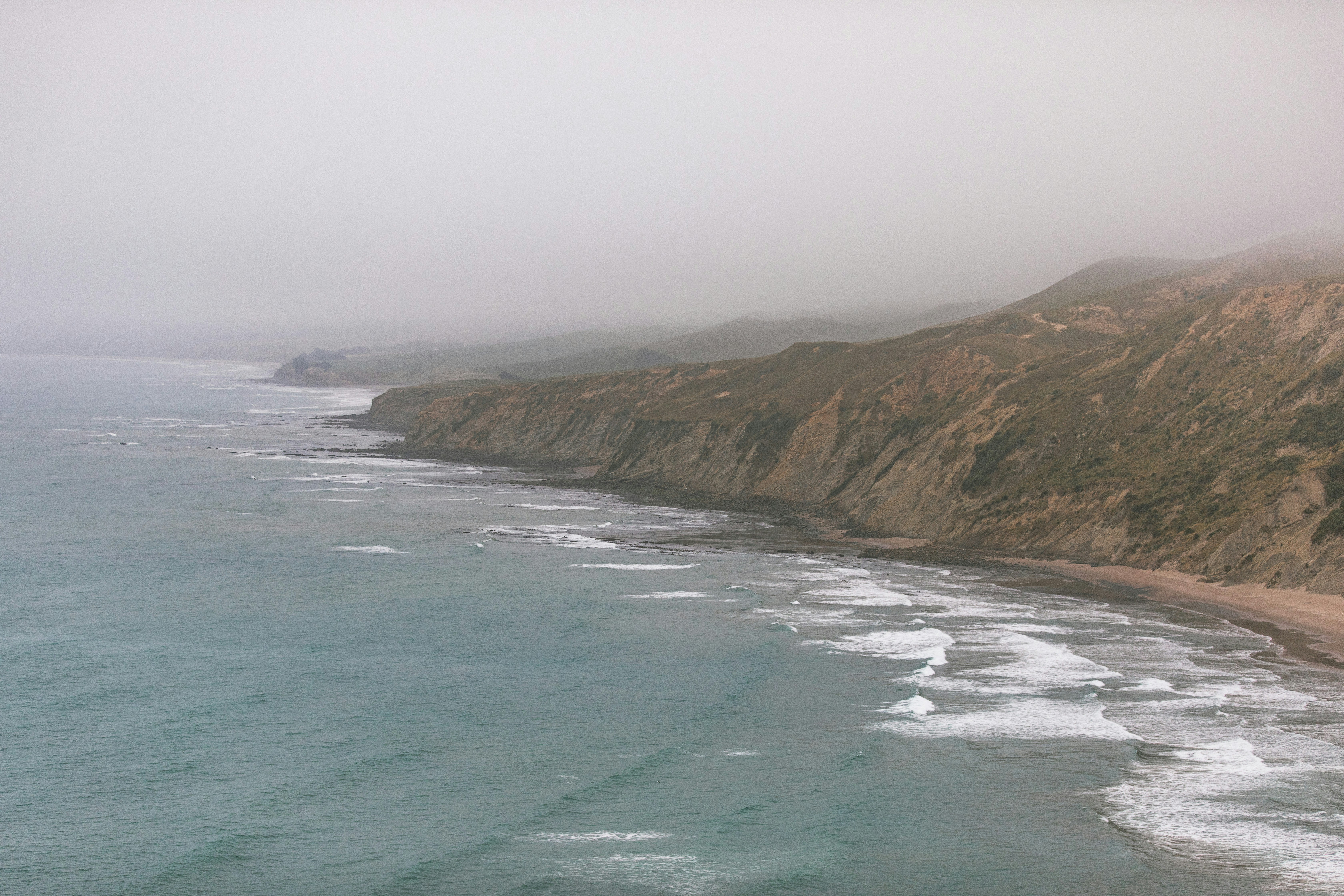 Mist over the Coastal Ridge: A Quiet Convergence of Sea and Cliff