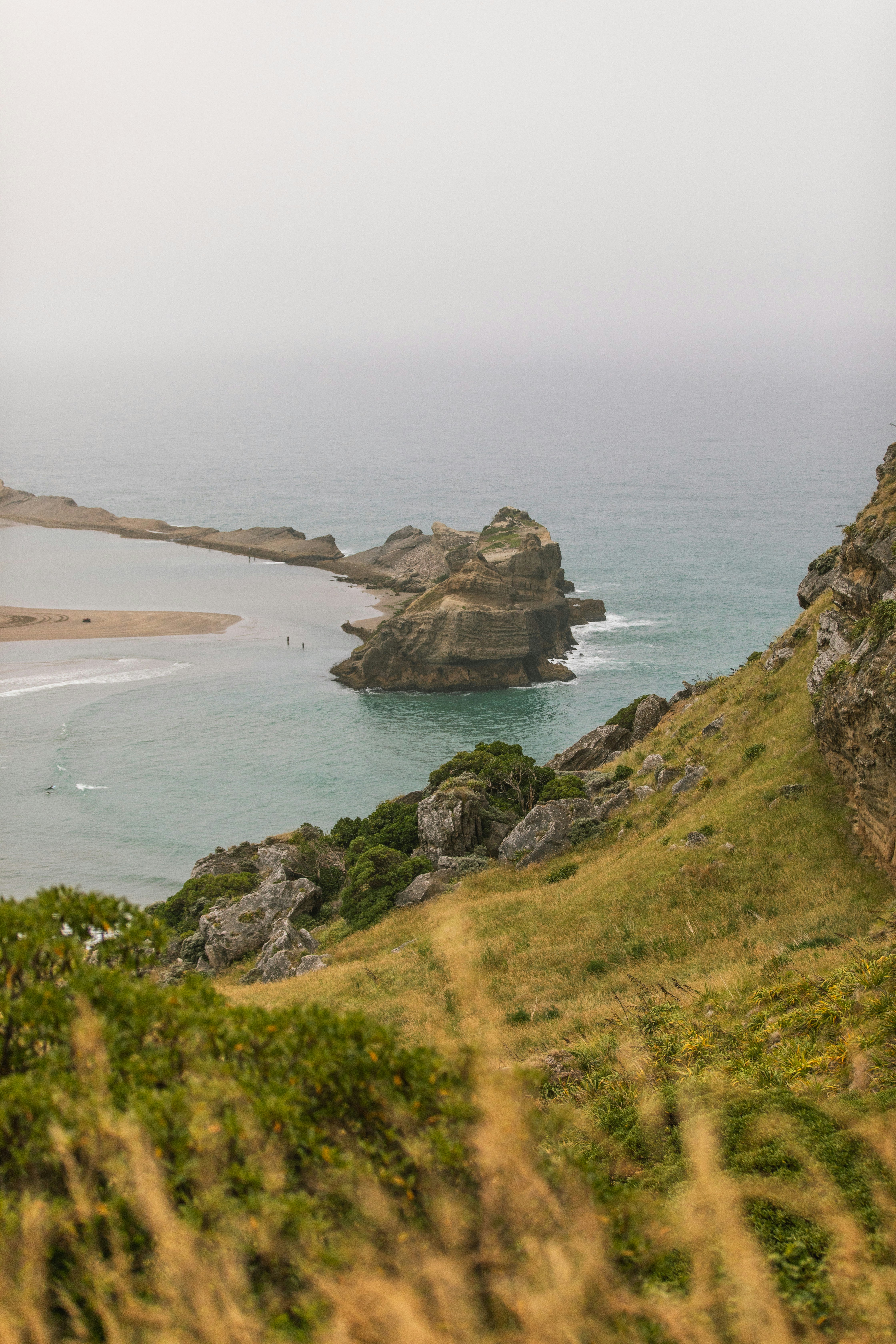 Cliffside Vista: Offshore Rock and Curving Shore