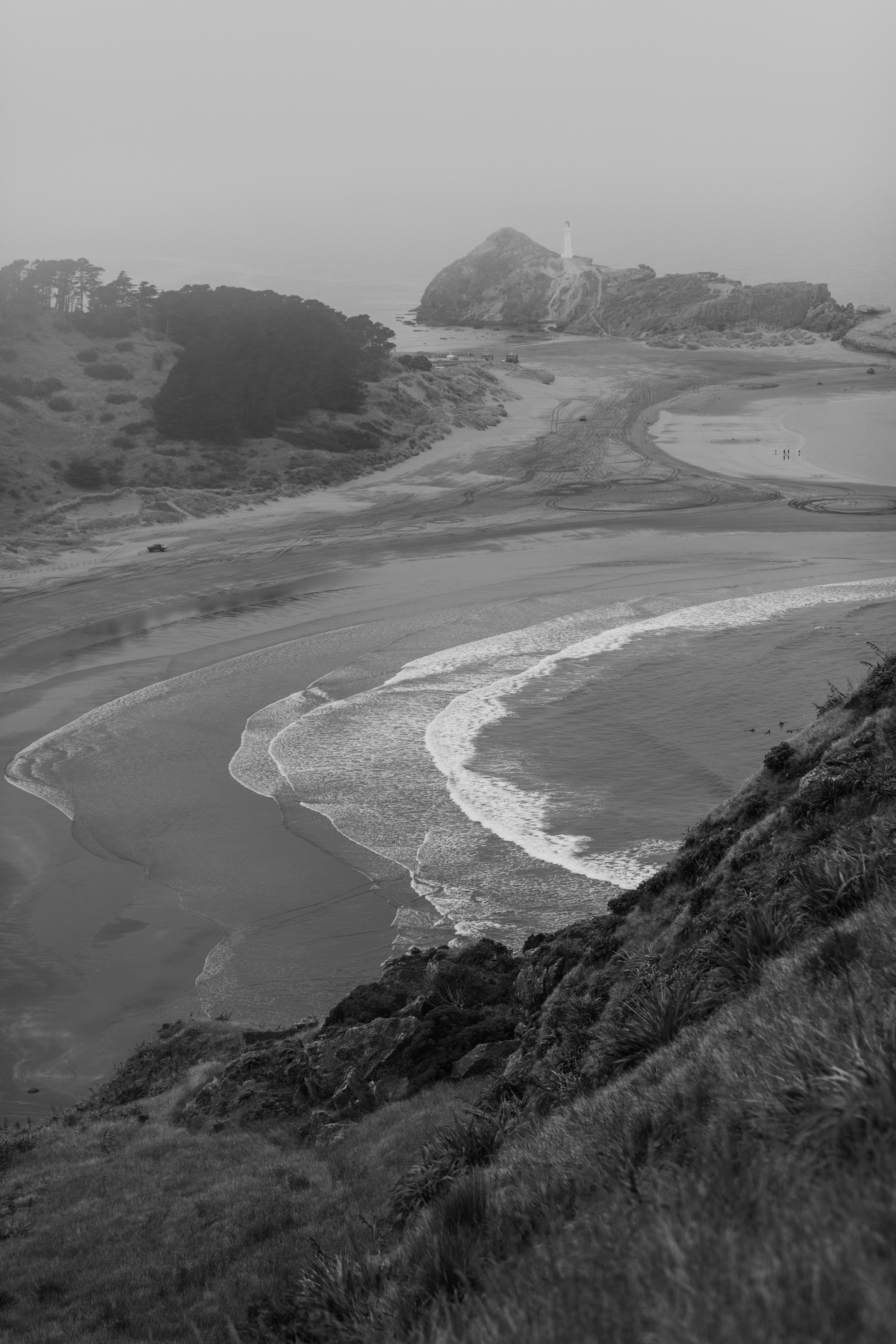 Mist-Soft Shoreline Beneath a Lone Light