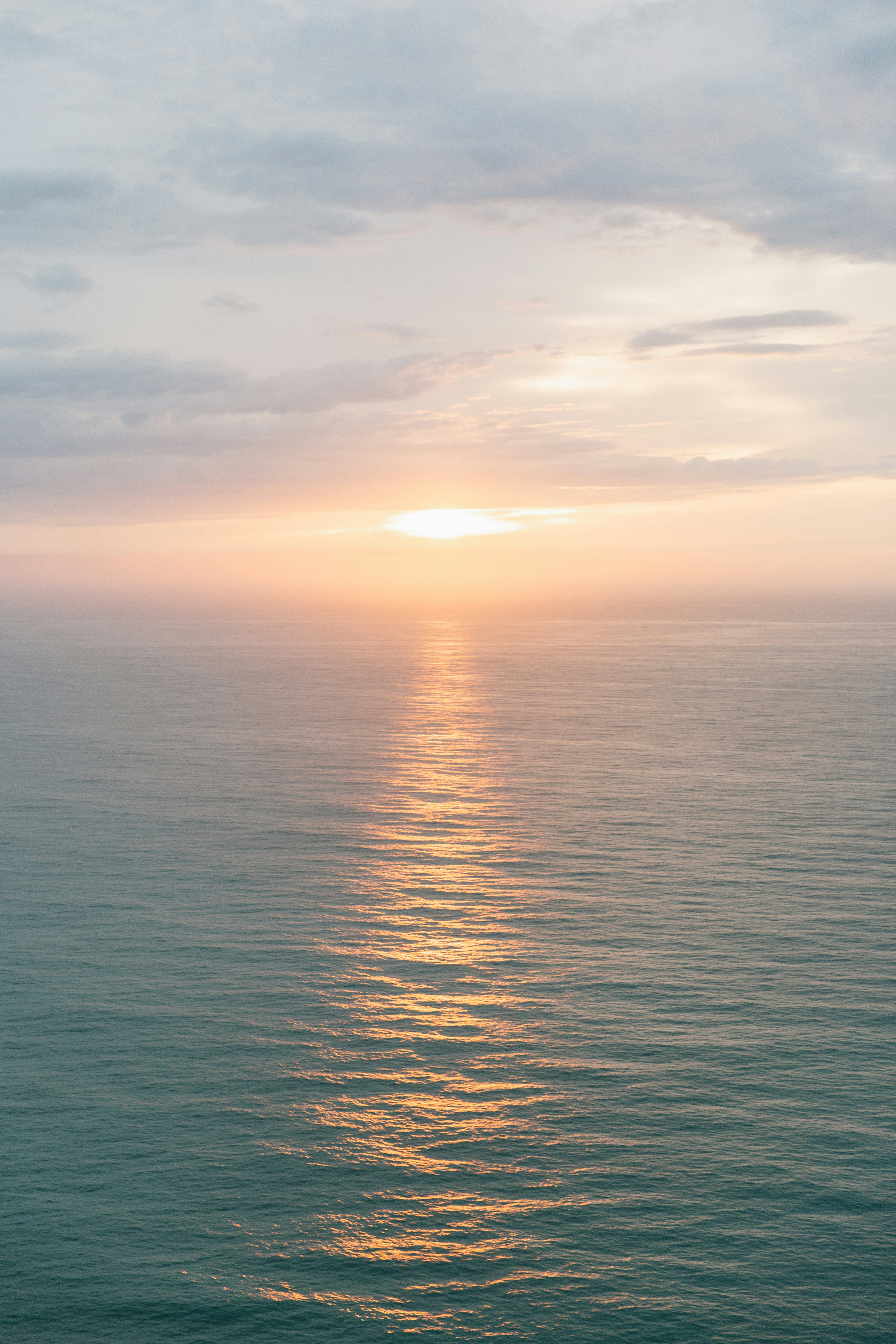 Horizon Glow: Quiet Sunset Over a Calm Sea