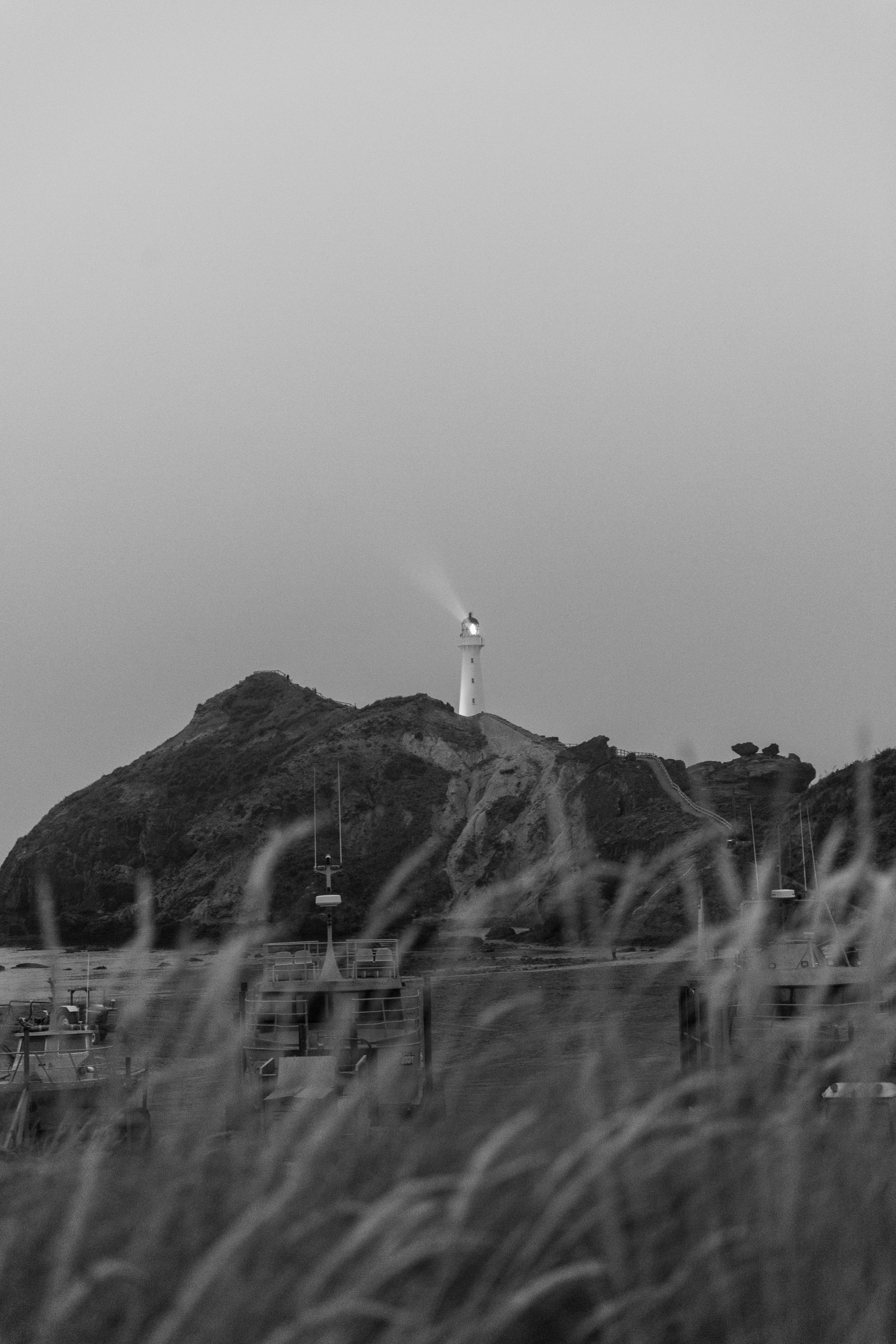 Lighthouse on Quiet Hill: A Seascape in Mono