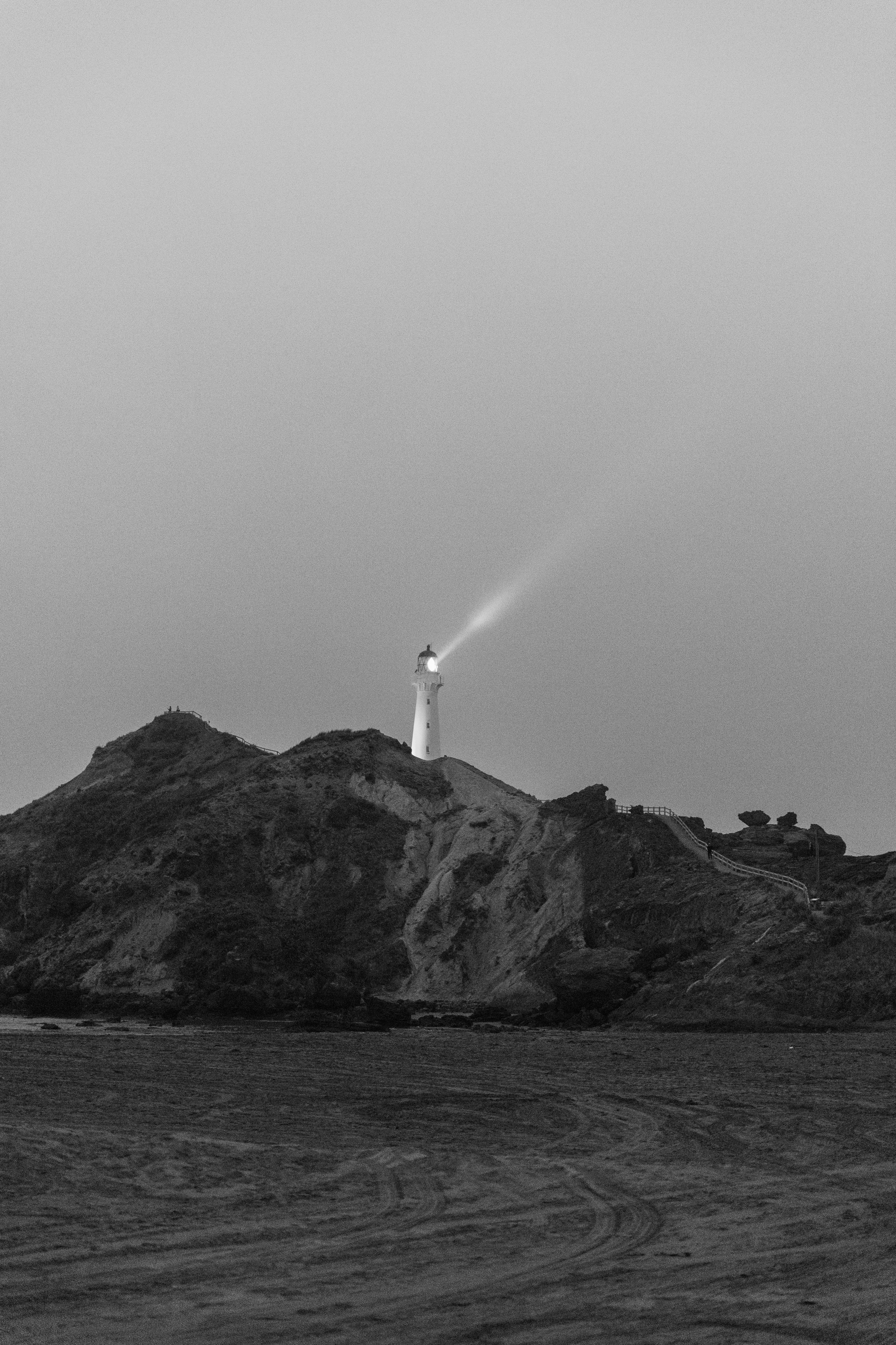 Lighthouse Sentinel: Beam Cutting Through a Quiet Horizon