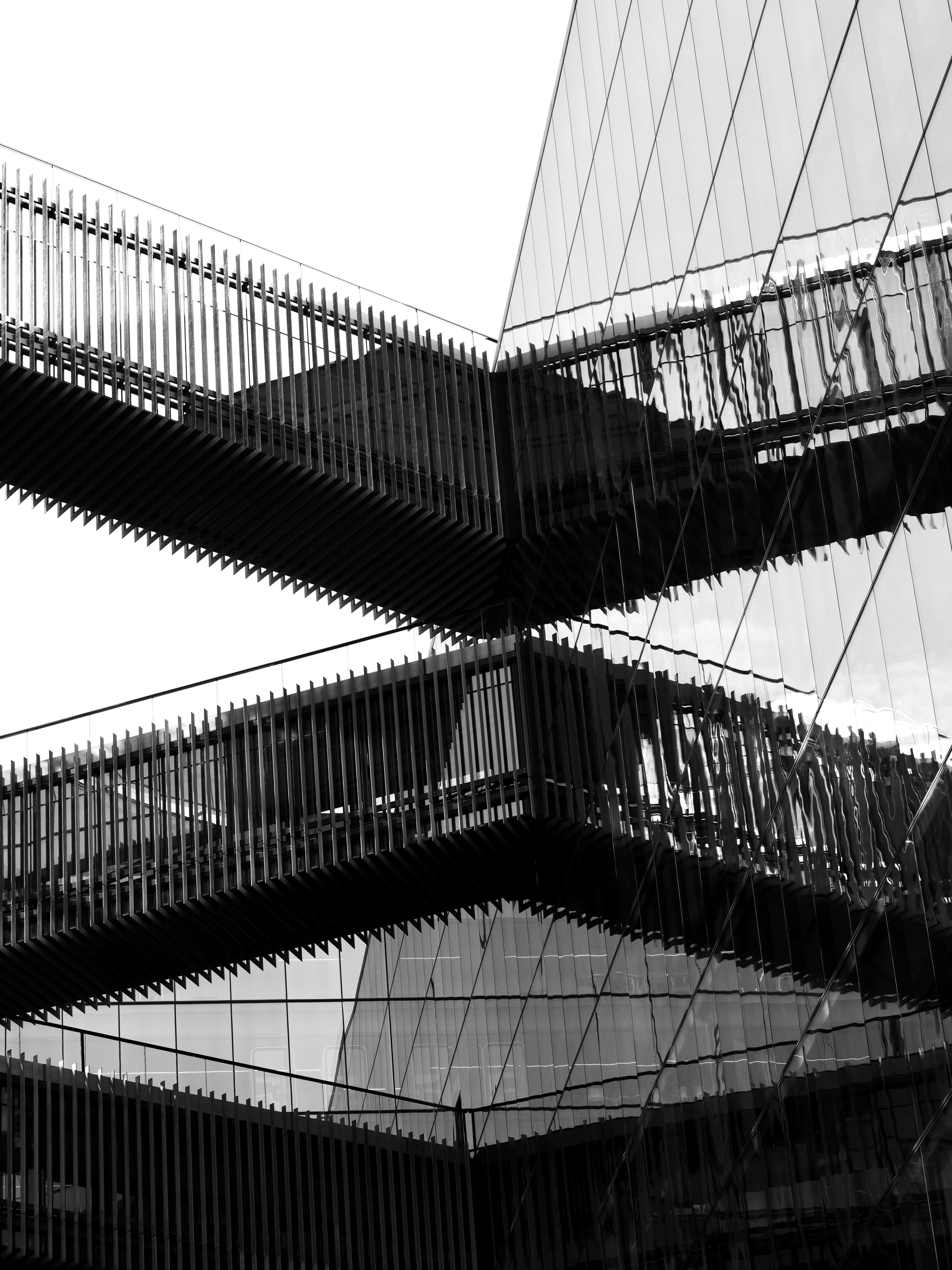 Intersecting Glass: A Play of Angles in Steel and Reflection
