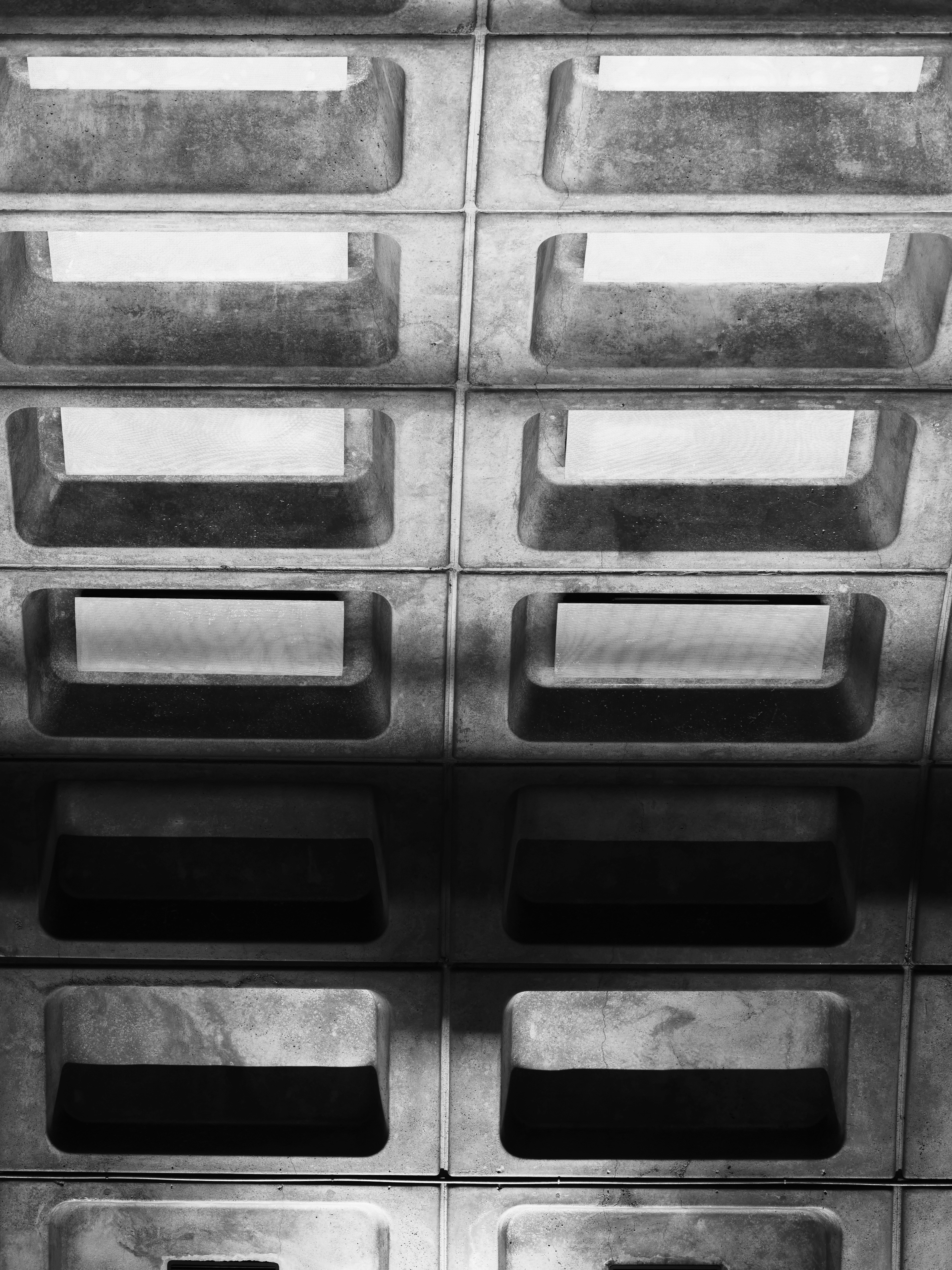 Grain and Geometry: A Grid of Metal Drawers in Mono Tone