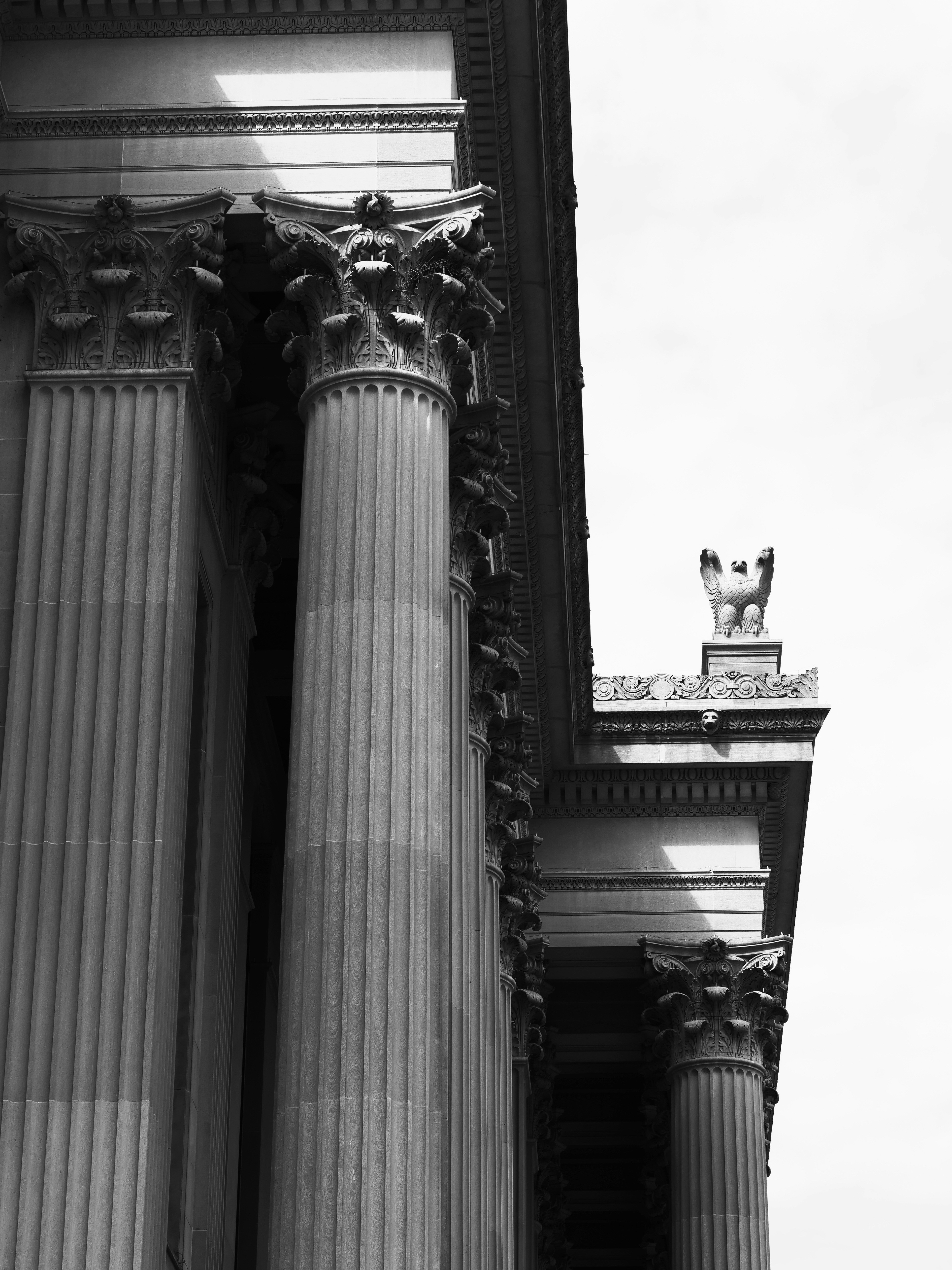 Colossal Columns: A Monumental Corner in Monochrome