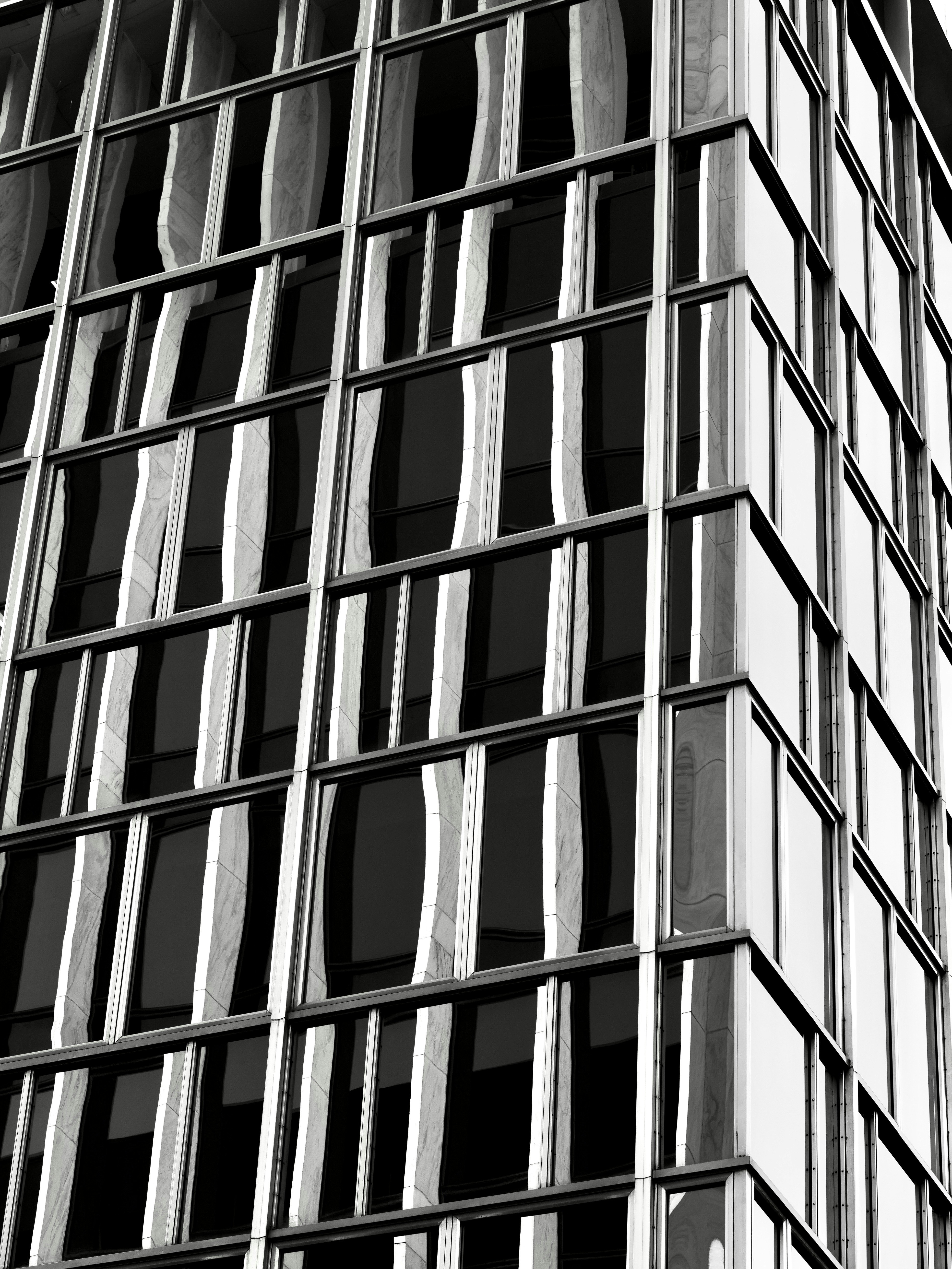 Chevroned Glass: A Faceted Facade in Monochrome