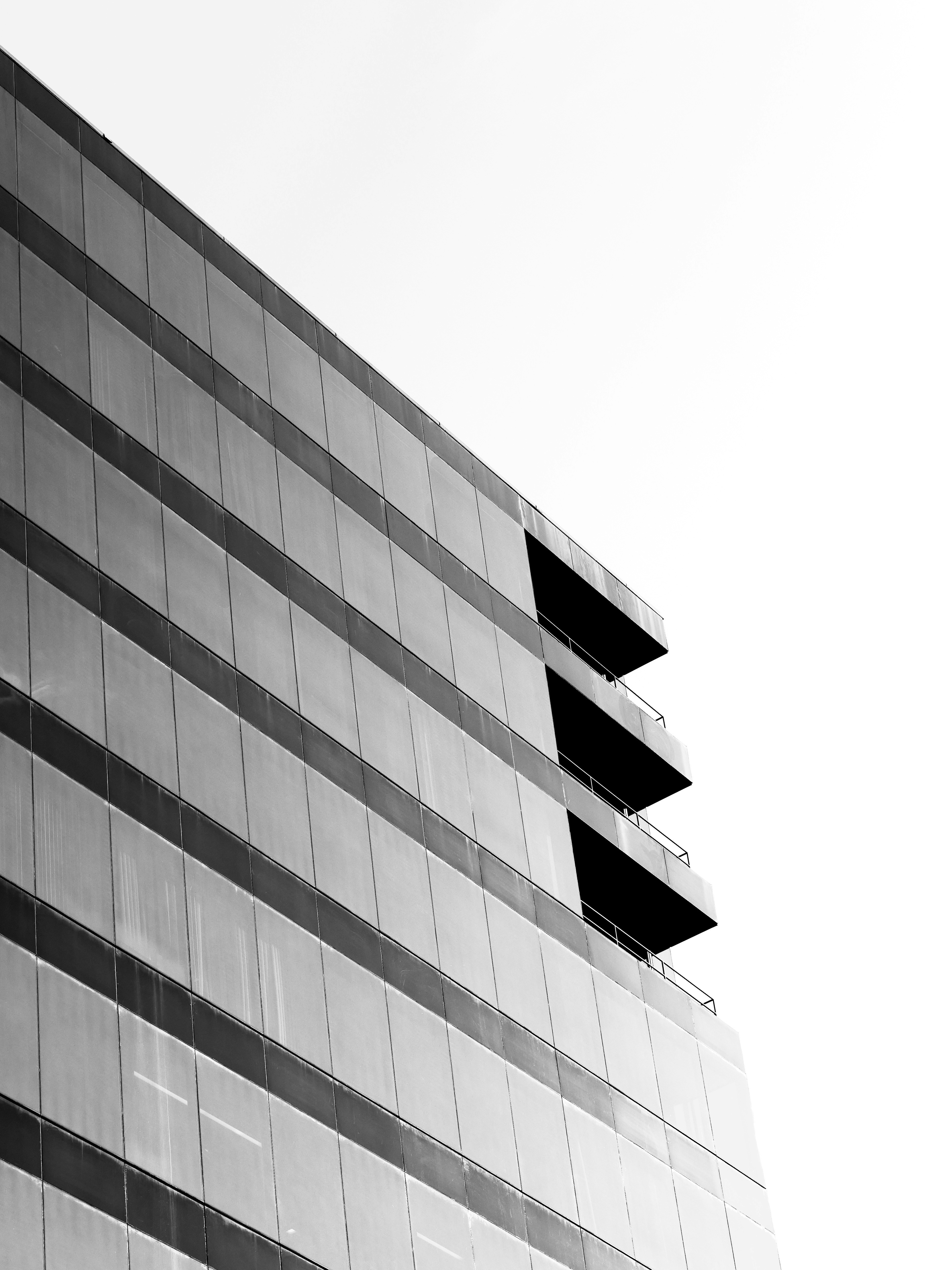 Vertical Facade: A Geometric Portrait of Glass and Shadow