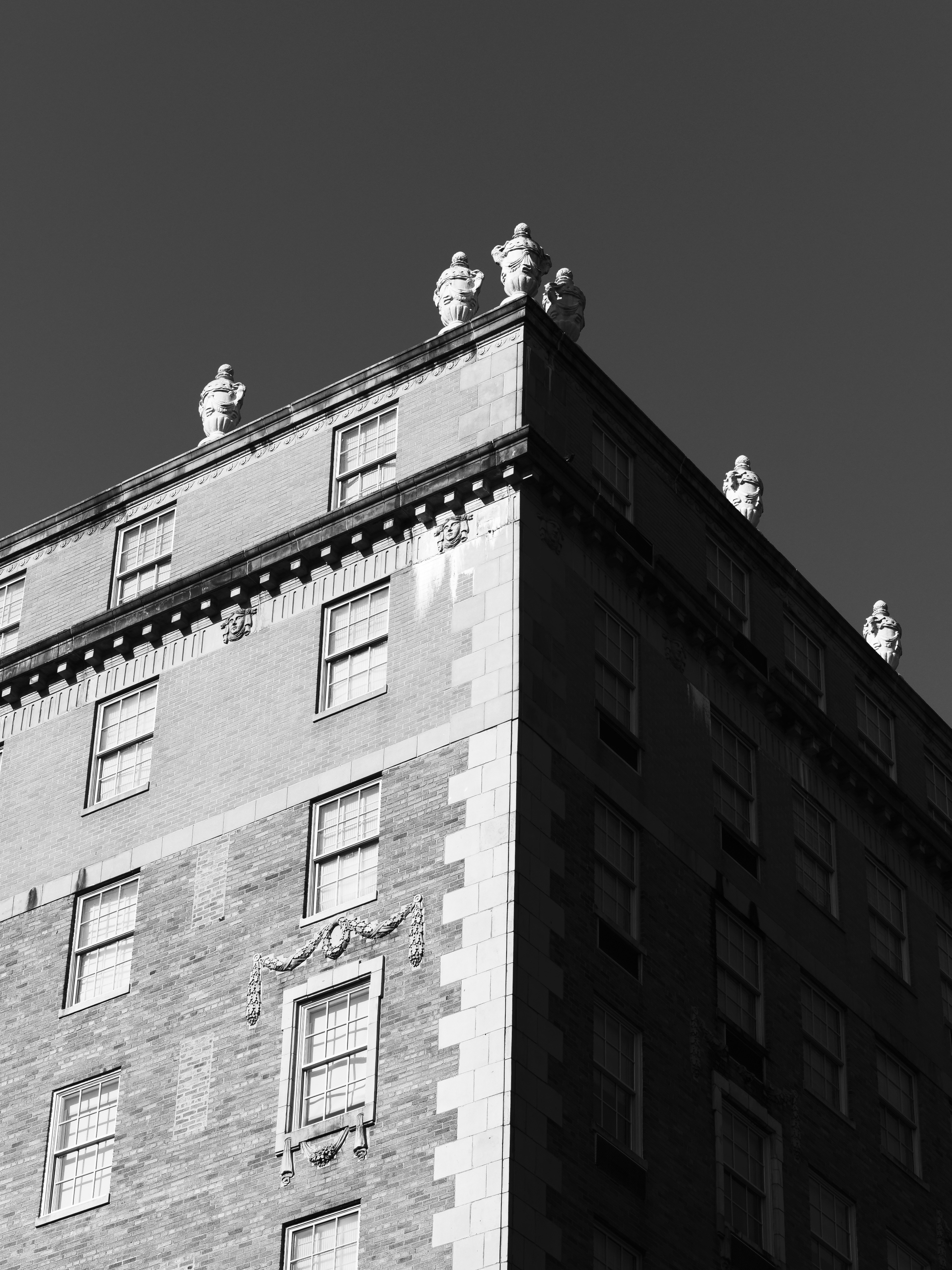 Architectural Crown: Statues Gracing the Corner Tower