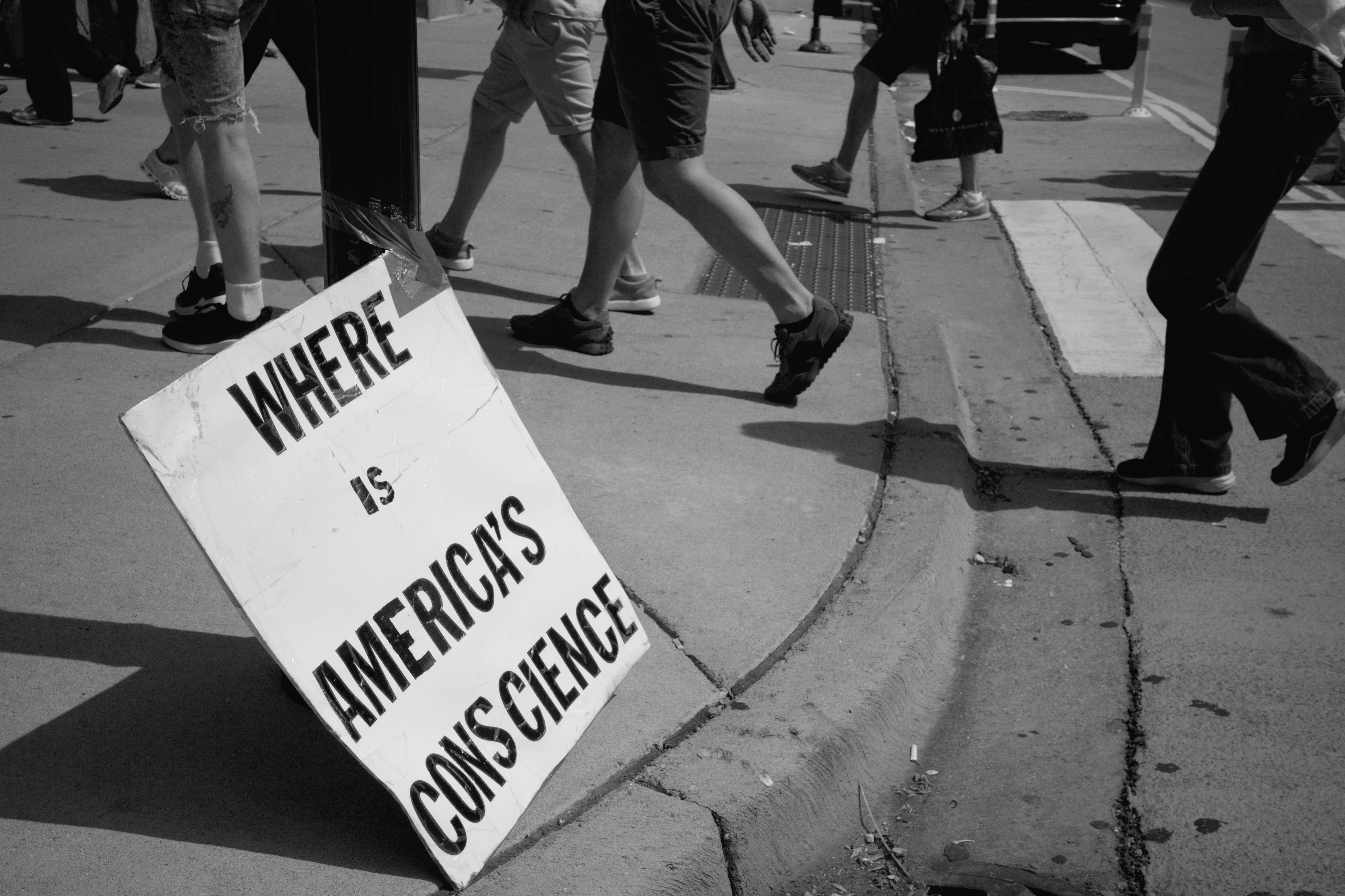 Where Is America's Consensus: A Street Sign on a City Curb