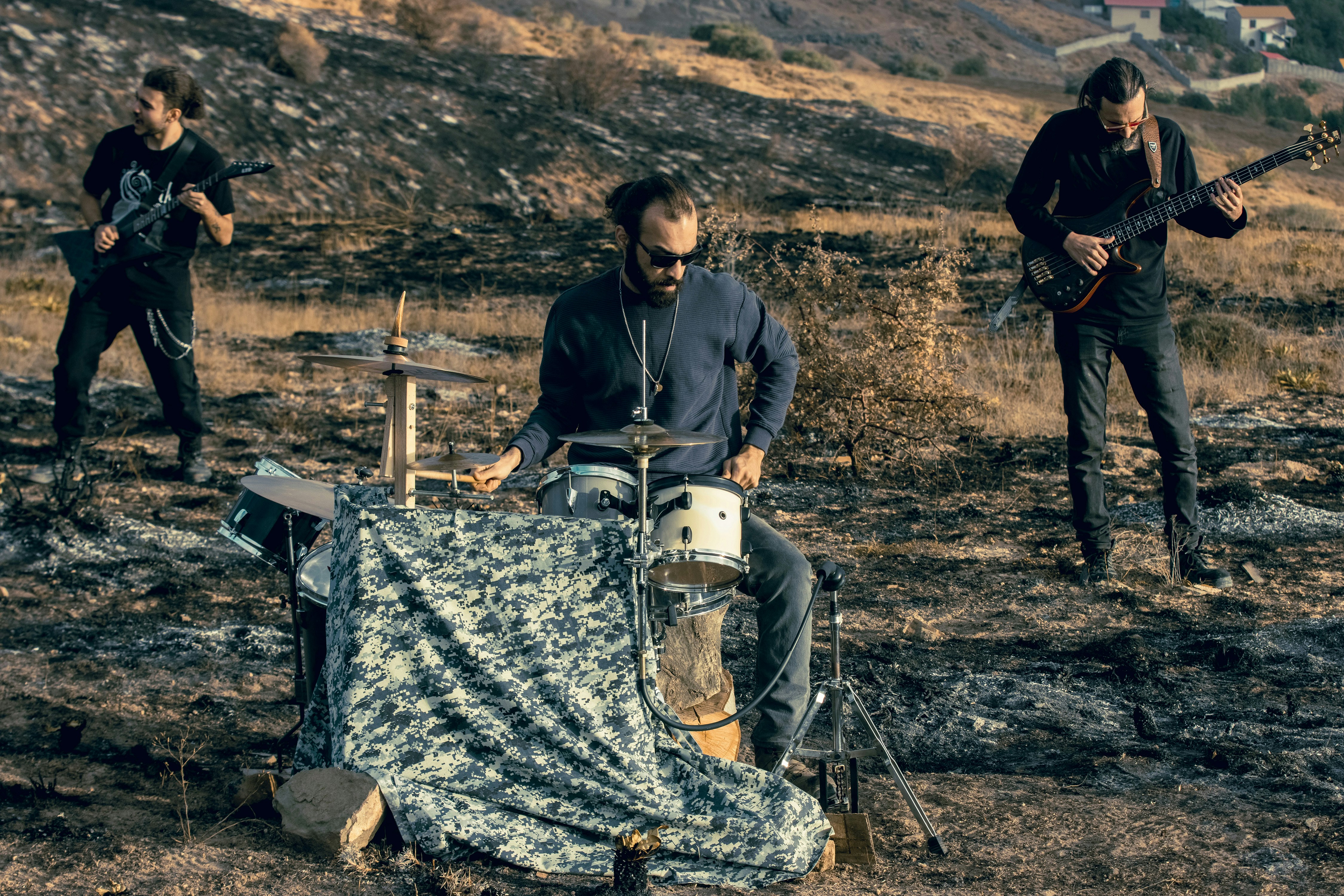 Rhythm Under an Open Sky: A Trio of Musicians in a Desert Clearing