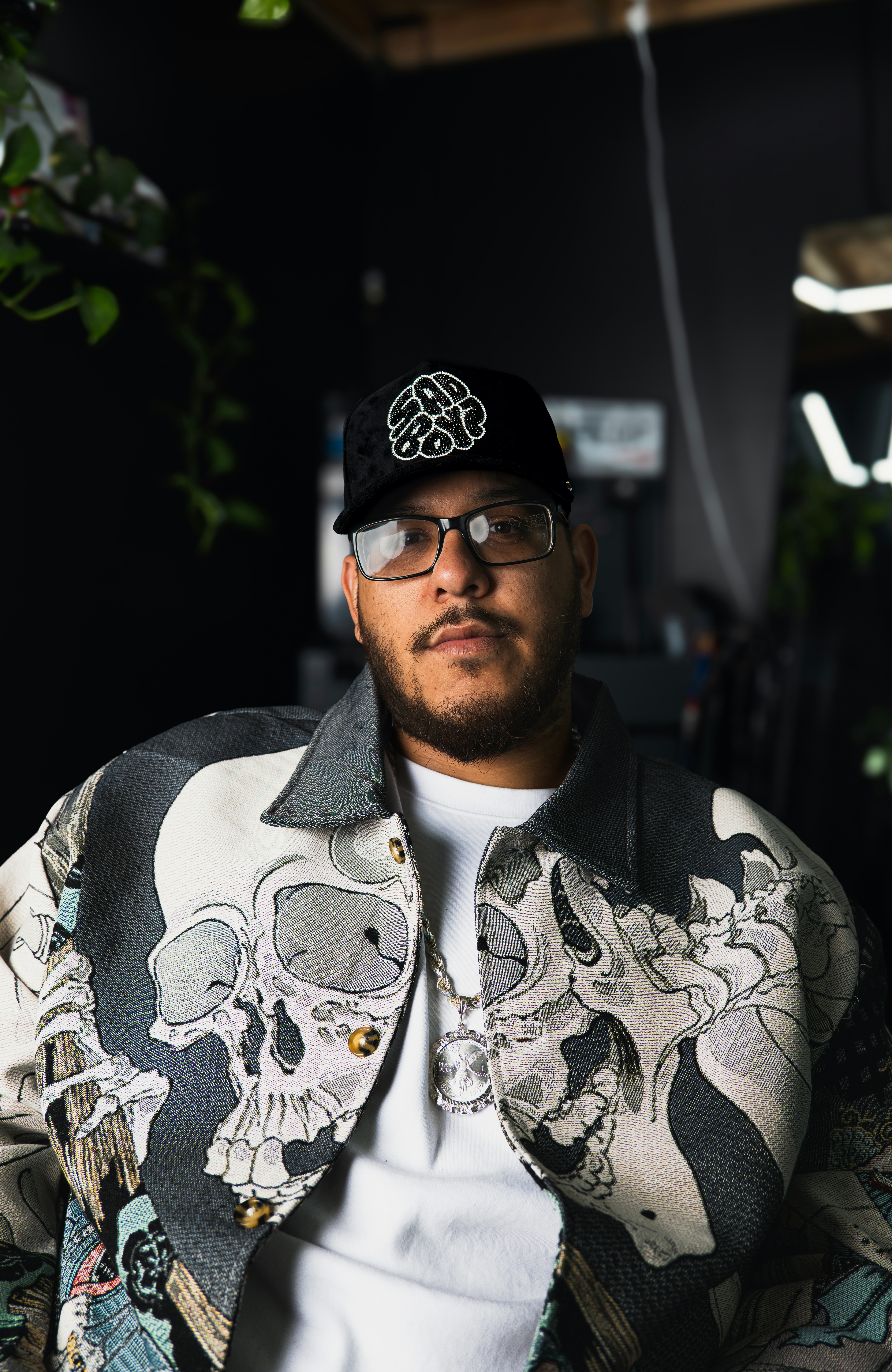 Studio Portrait: A Quiet Confidence in a Skull-pattern Jacket