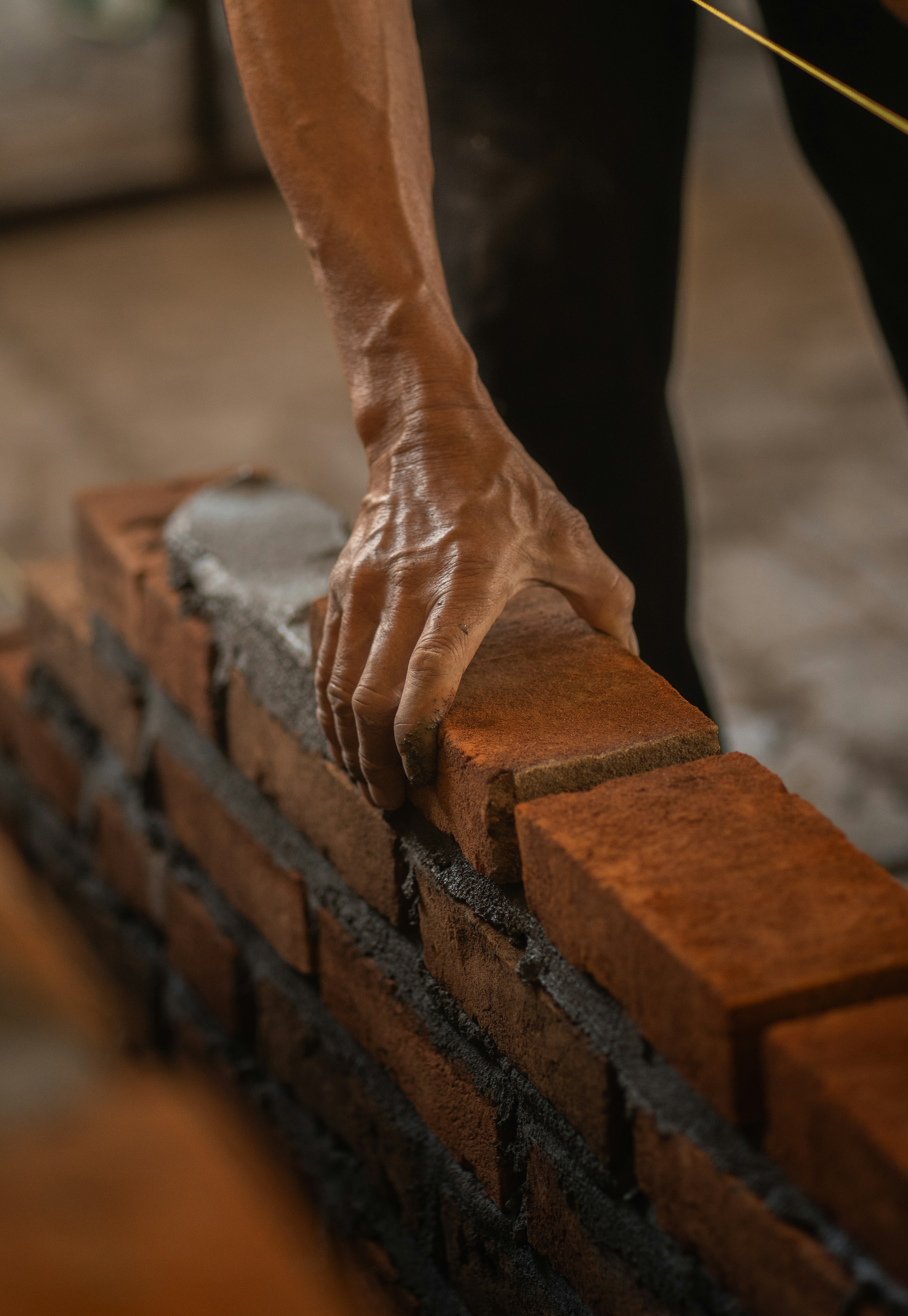 Brick by Brick: A Hand Steady in the Build of a Wall