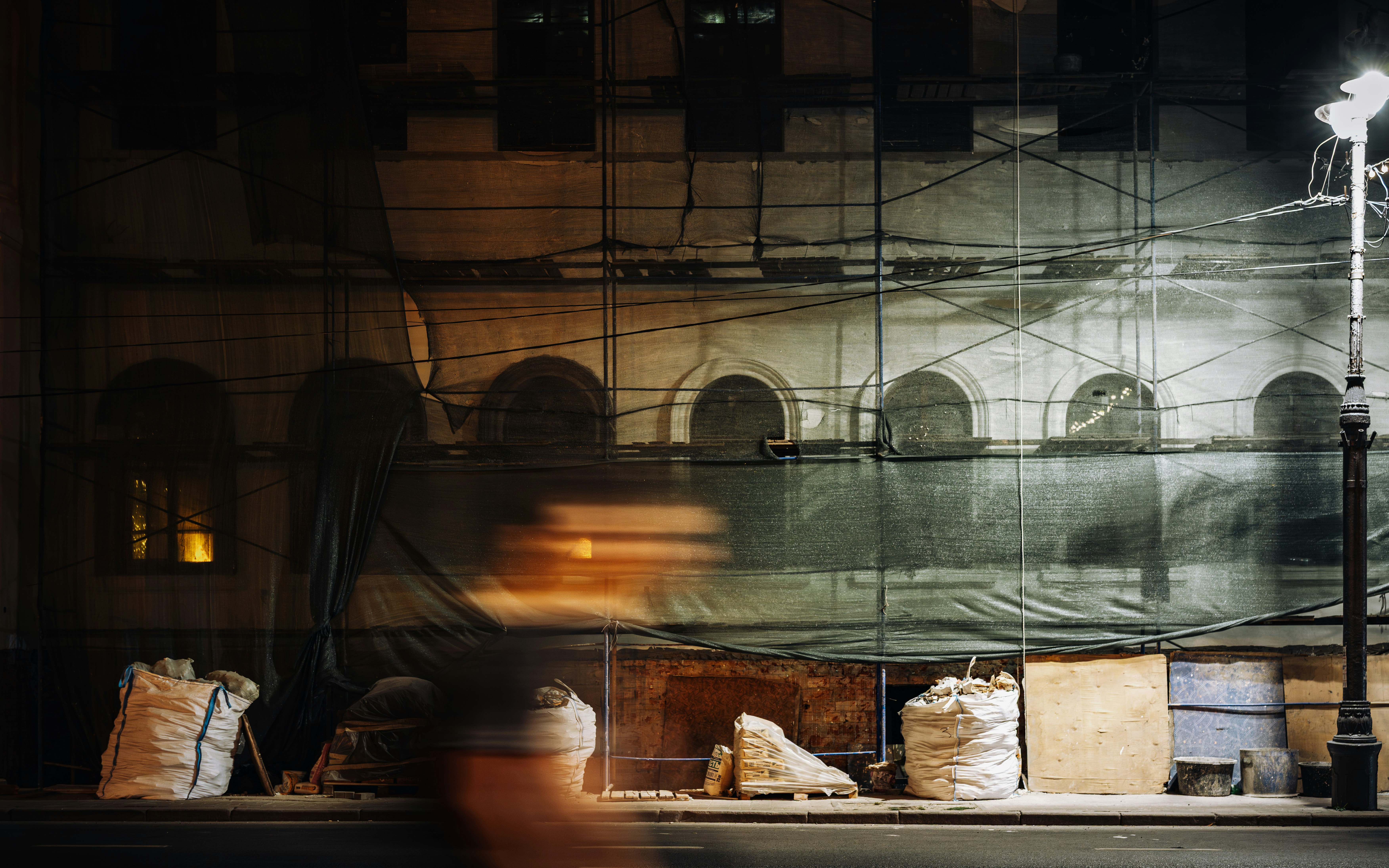 Night Market Barricades: A Quiet Walk Past Sandbags and Lanterns