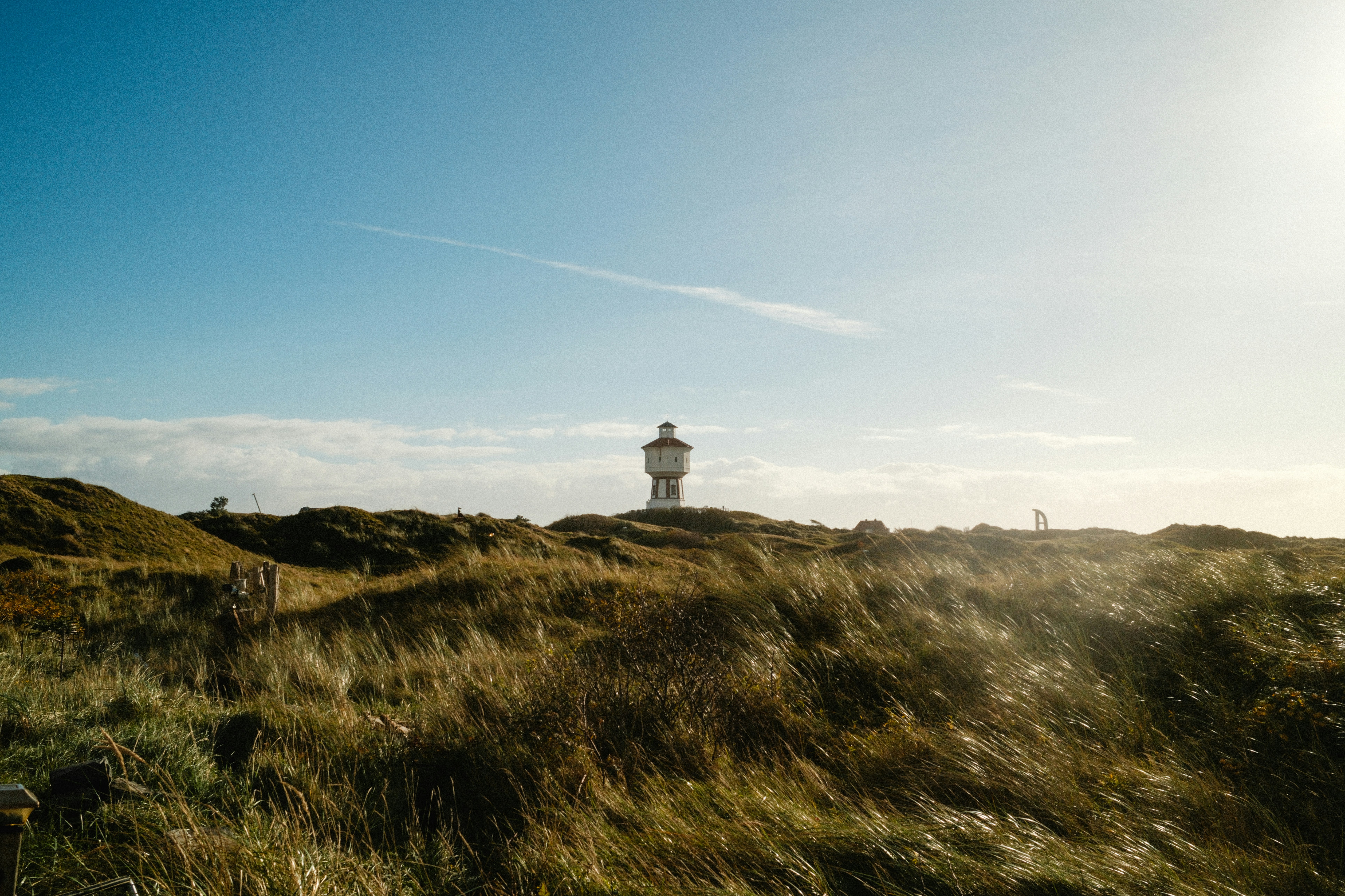 Lighthouse Over Dune Sea at Golden Hour
