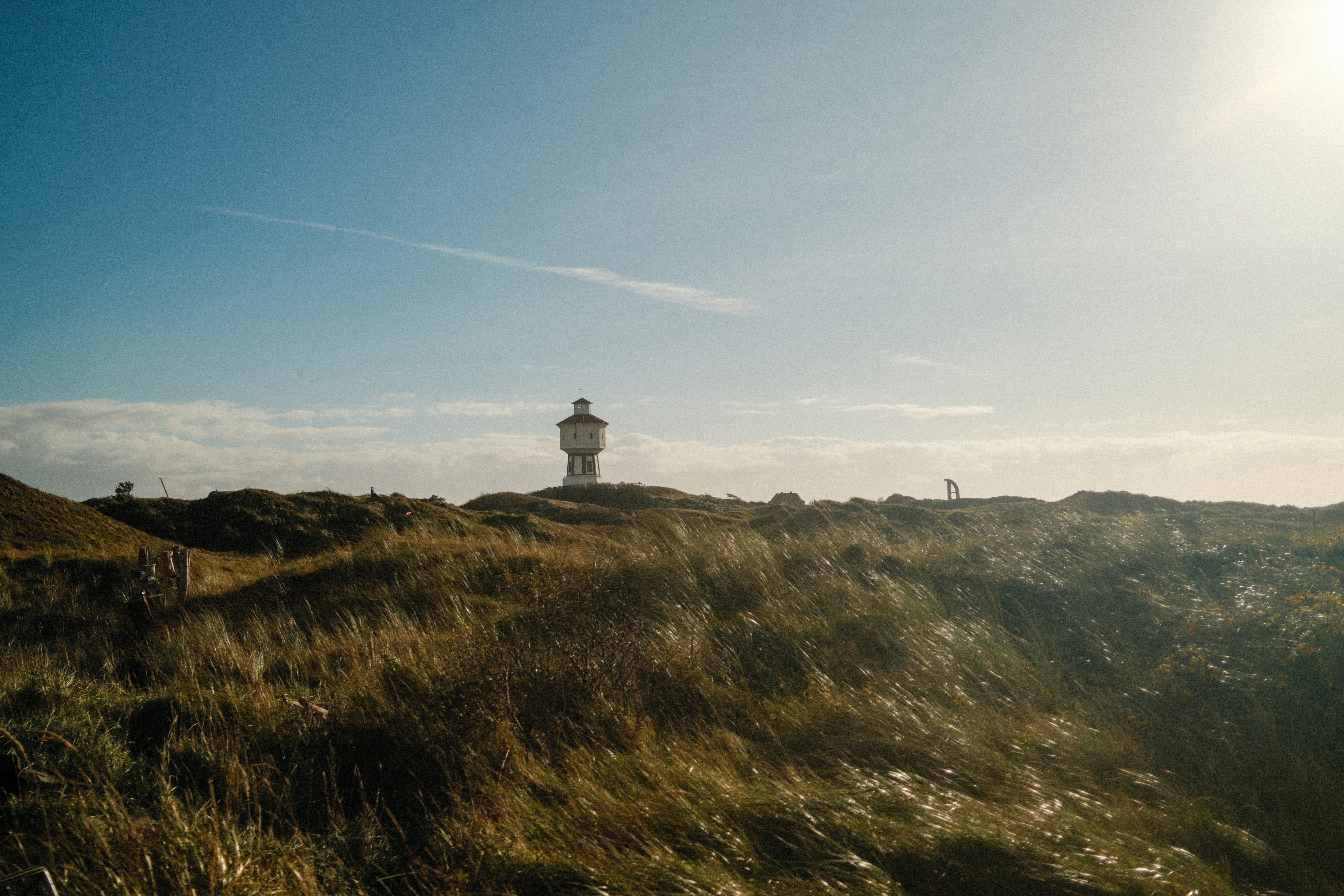 Lighthouse Dawn on the Wind-Swept Dune