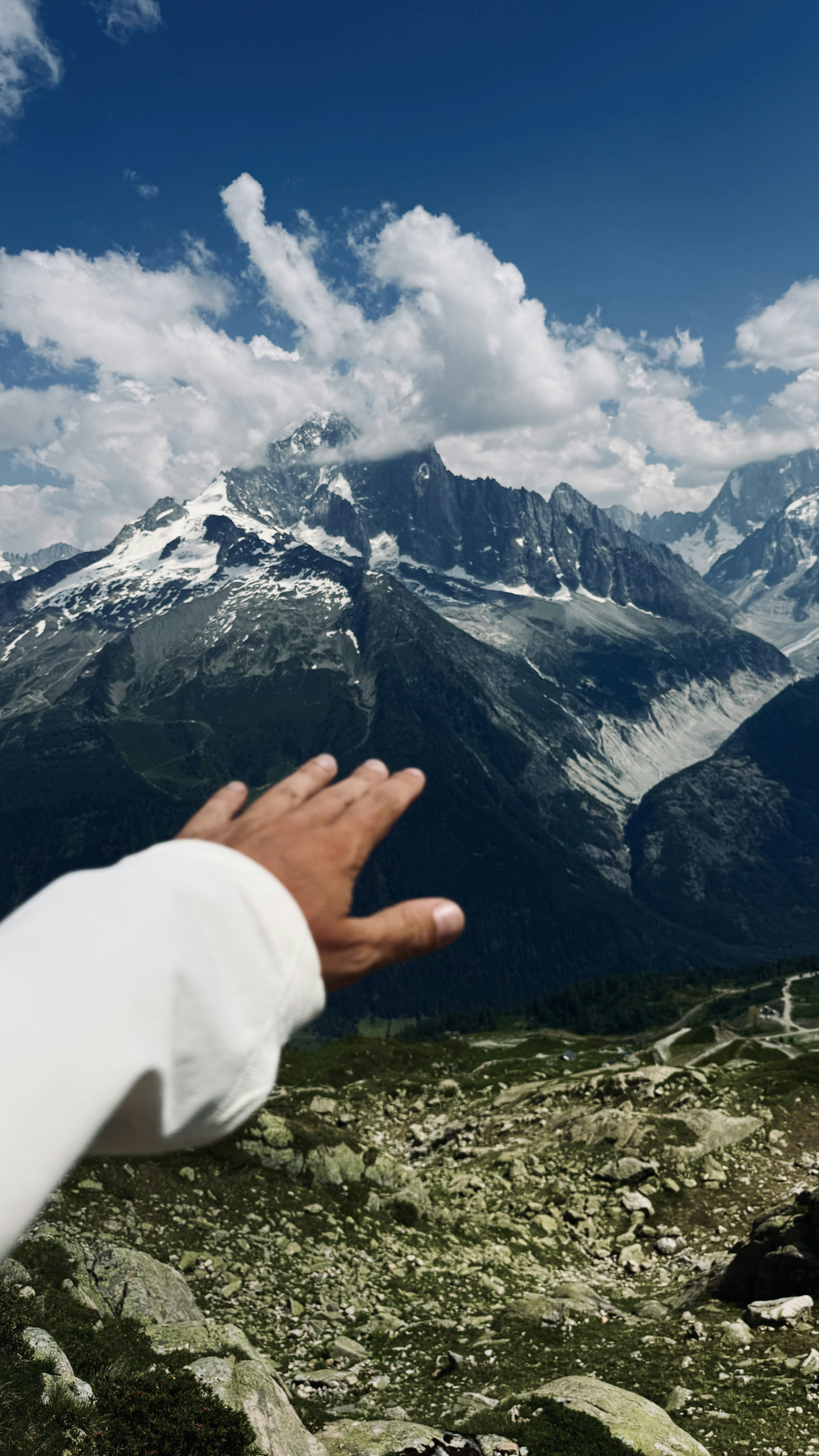 Outstretched Reach: Hand in the Rim of the Alps