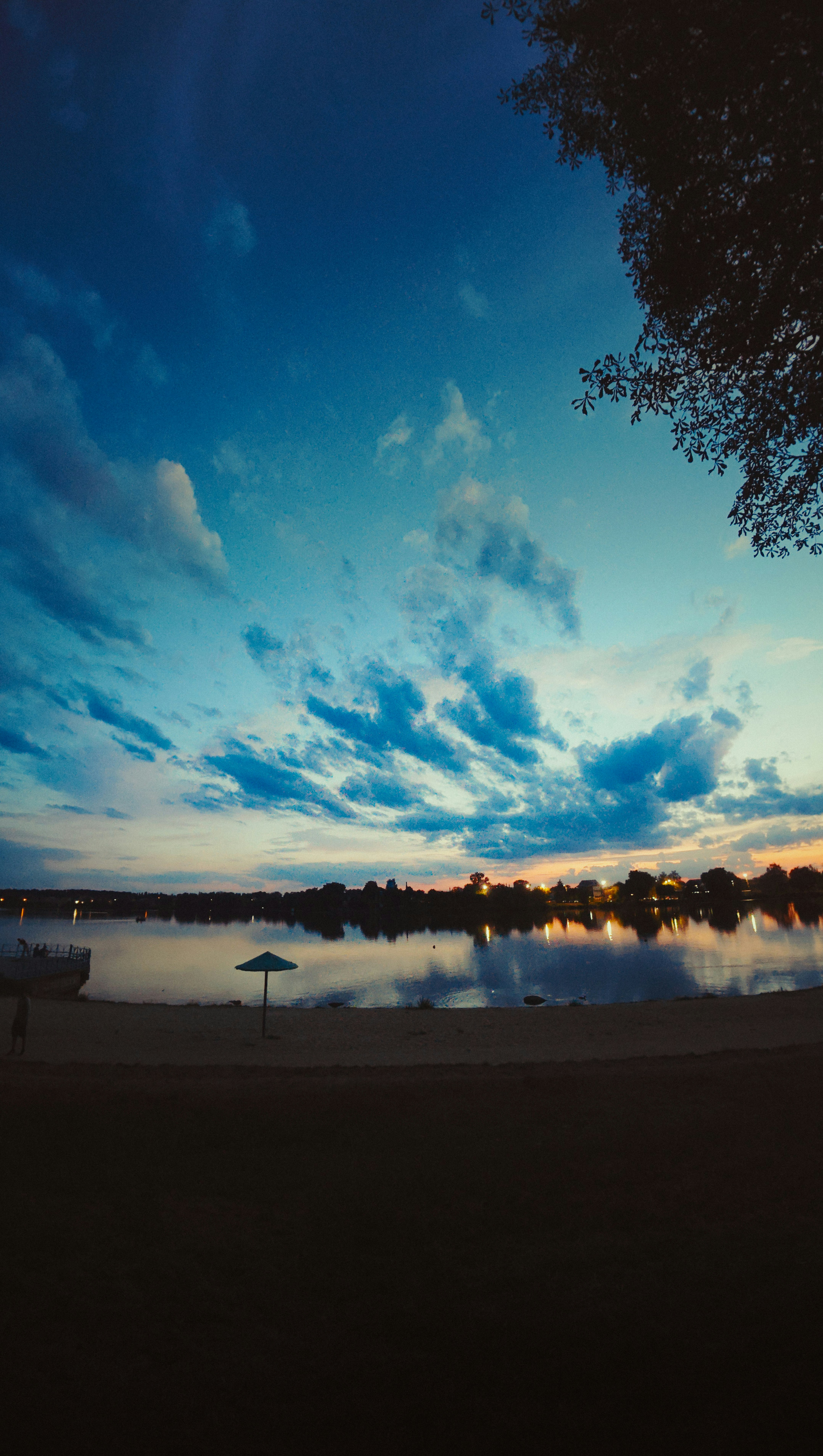 Dusk on the Quiet Lake: Sky, Shore, and Silhouettes