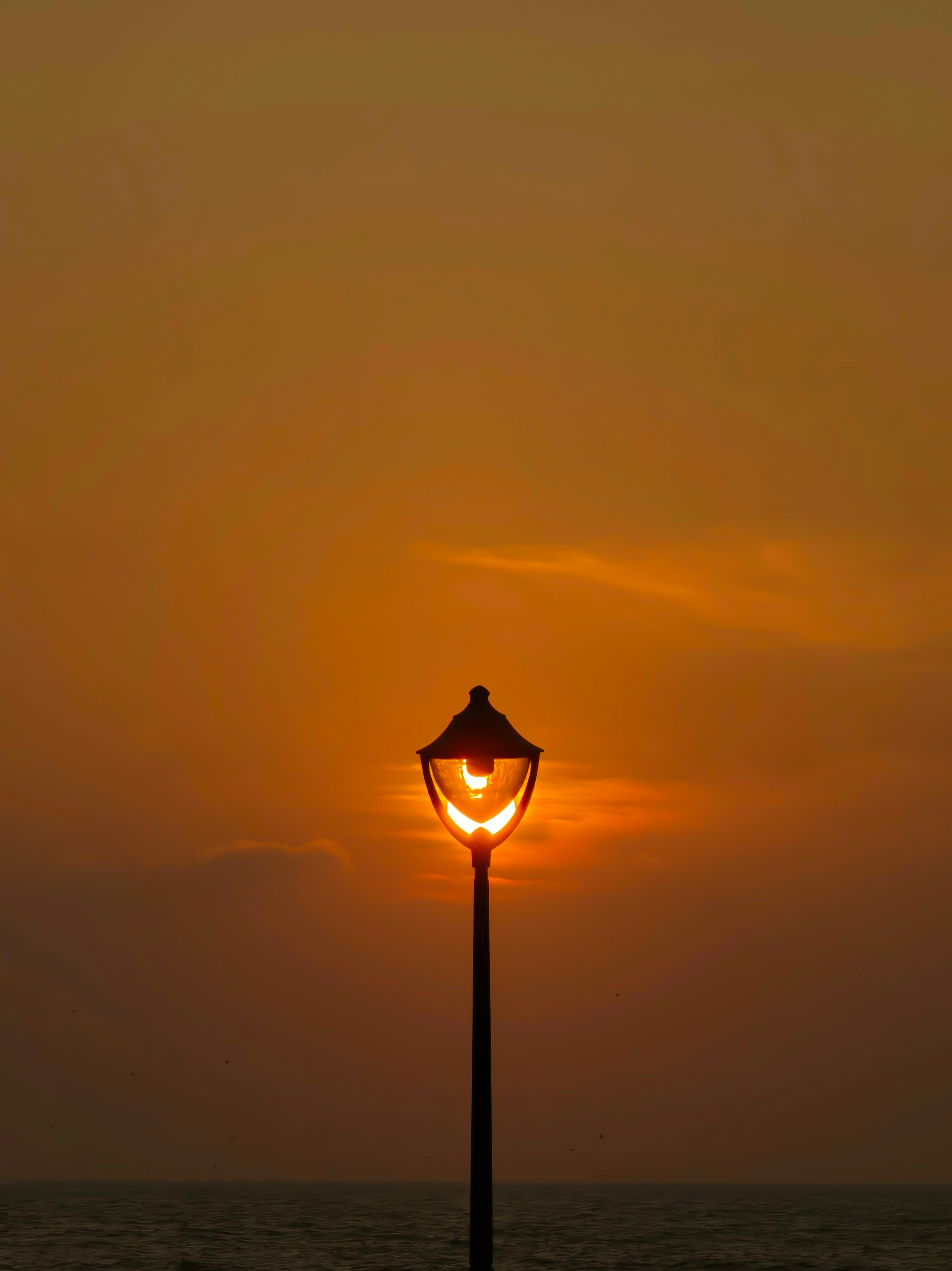 Sunset Lantern over Calm Seas