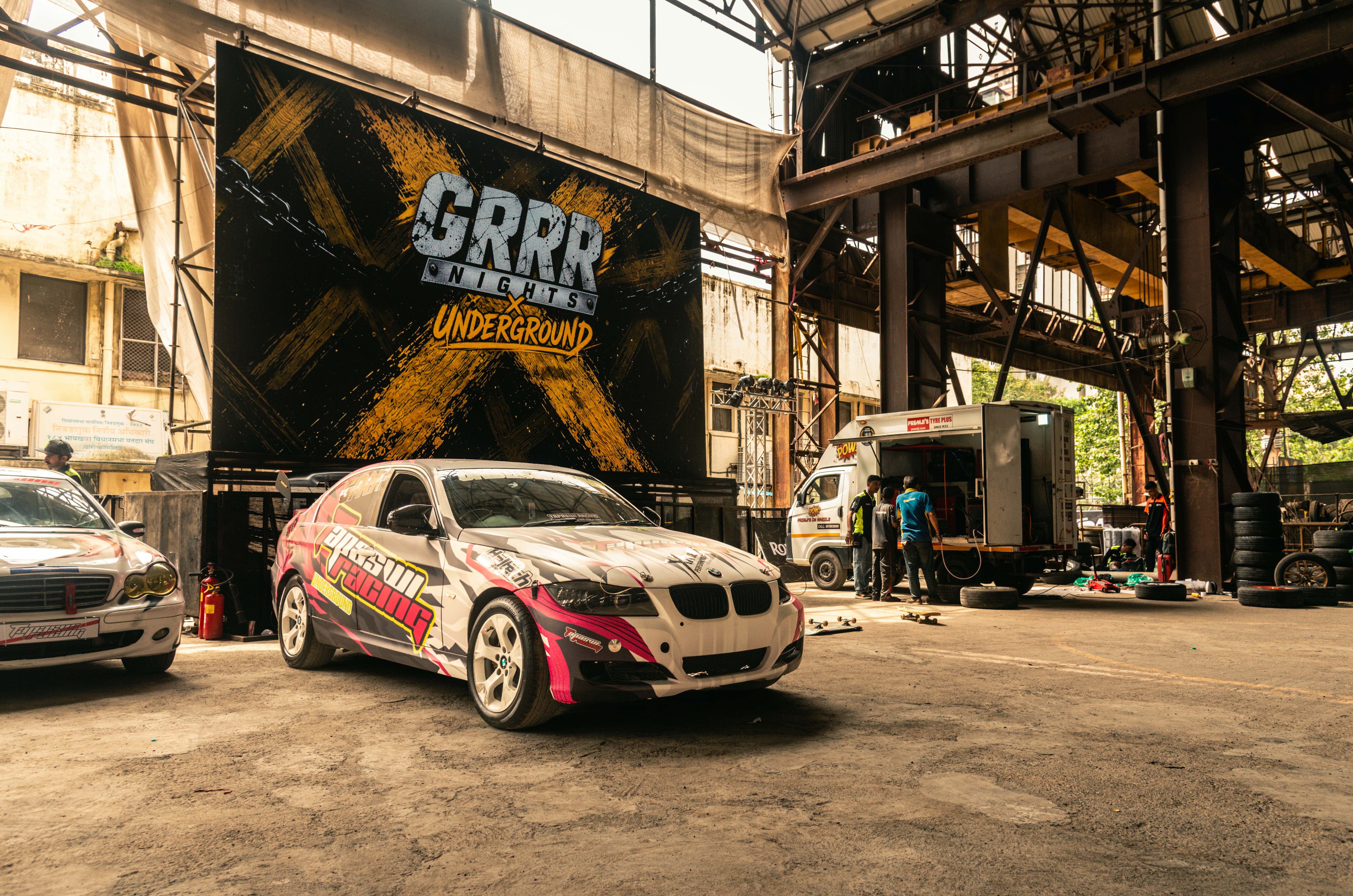 Painted Rally Stance: A Neon-Accent Street Car in an Industrial Yard
