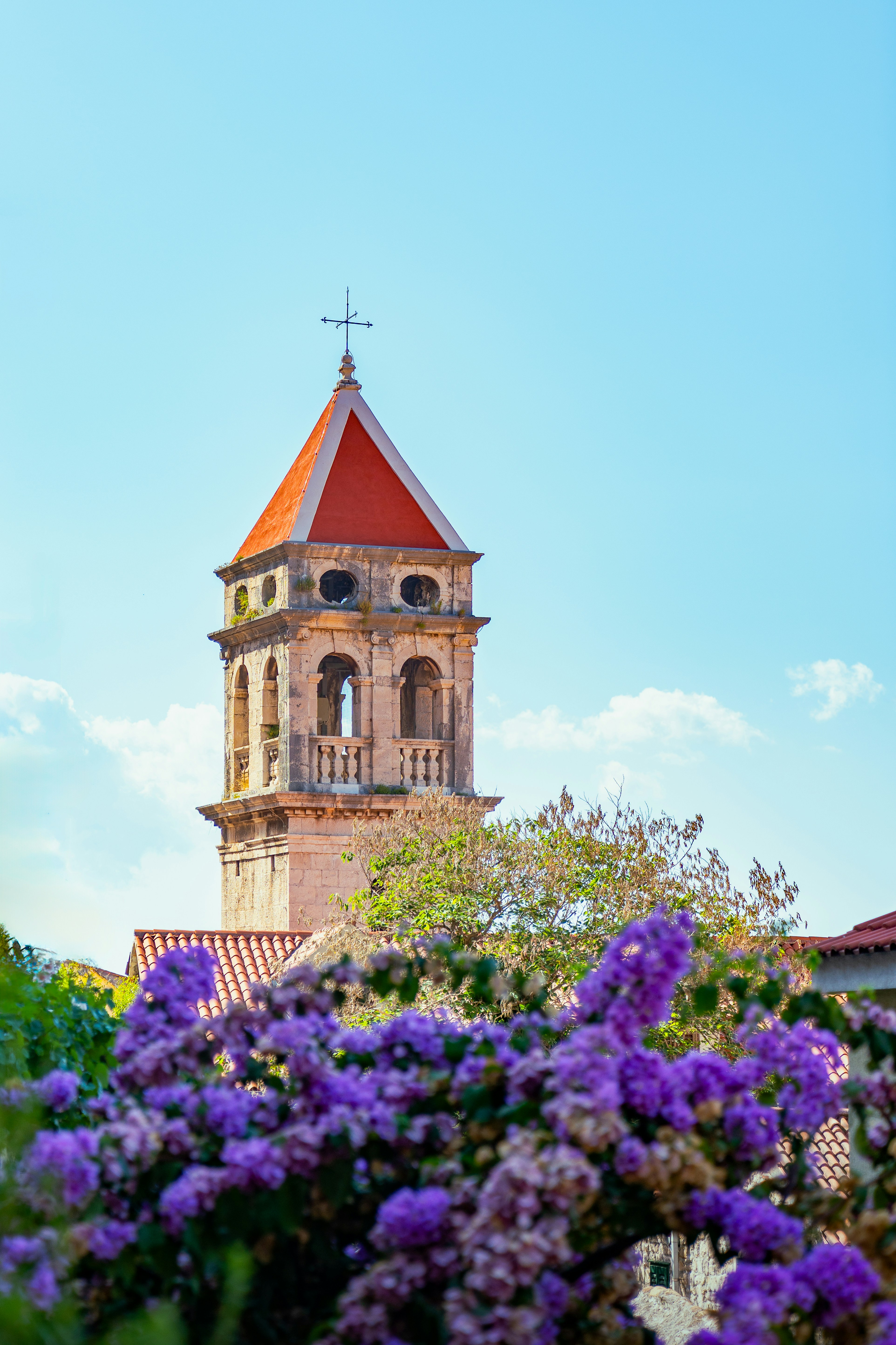 Stone Bell Tower Soaring Above Blooms