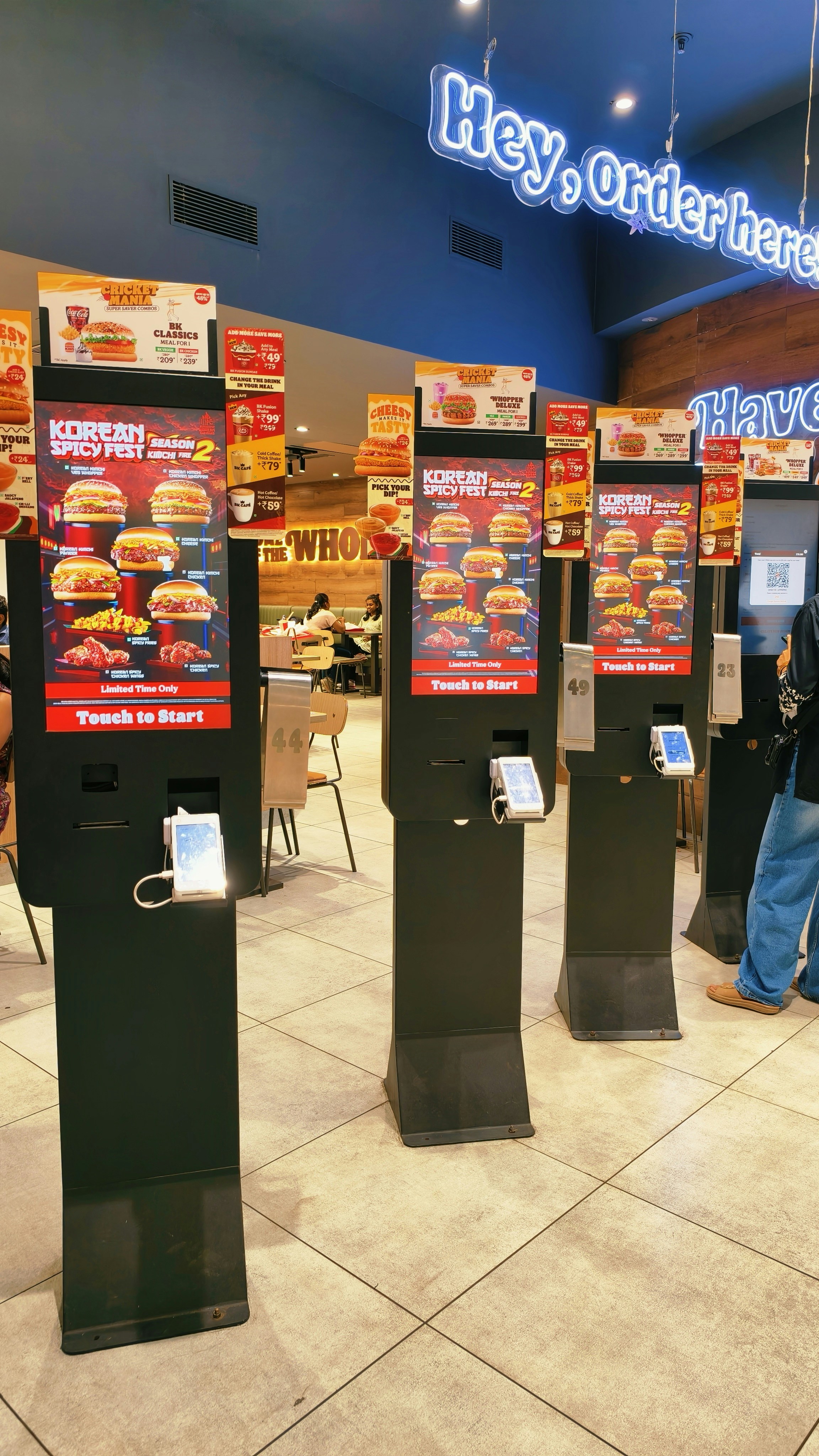 Kiosk Row at the Fast-Food Chain: Colorful Menu Towers Stand tall
