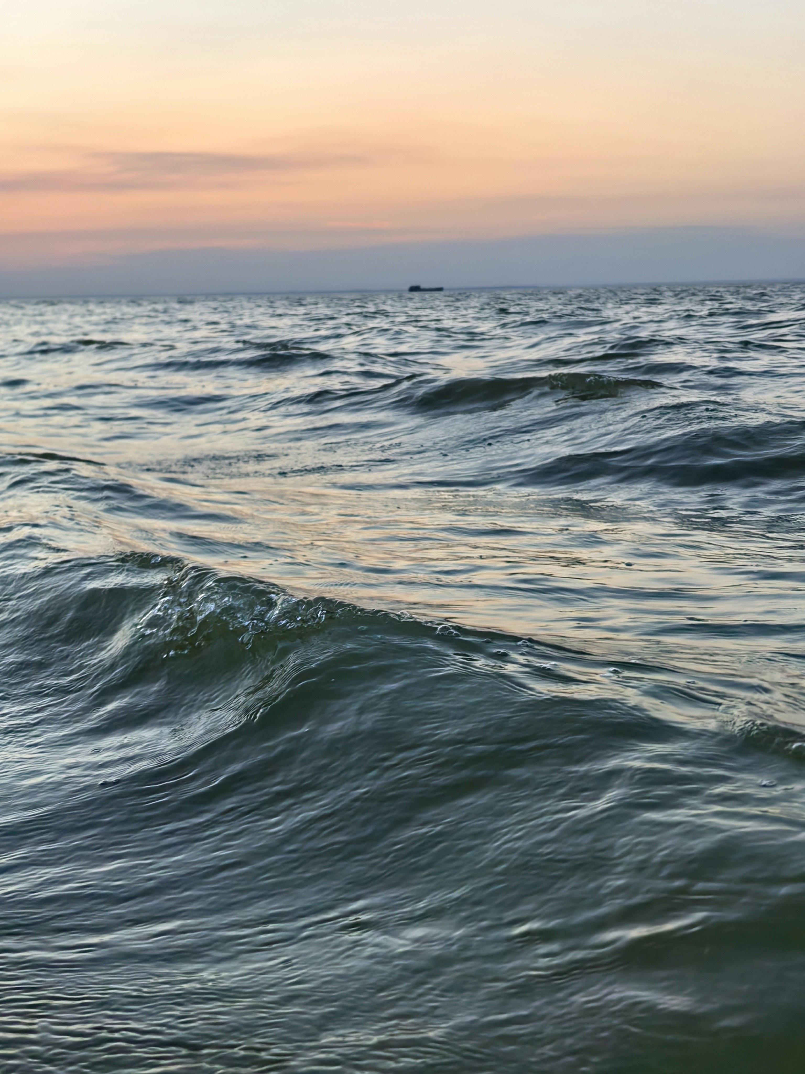 Sunset over Sheening Waves: A Vast Ocean in Quiet Motion