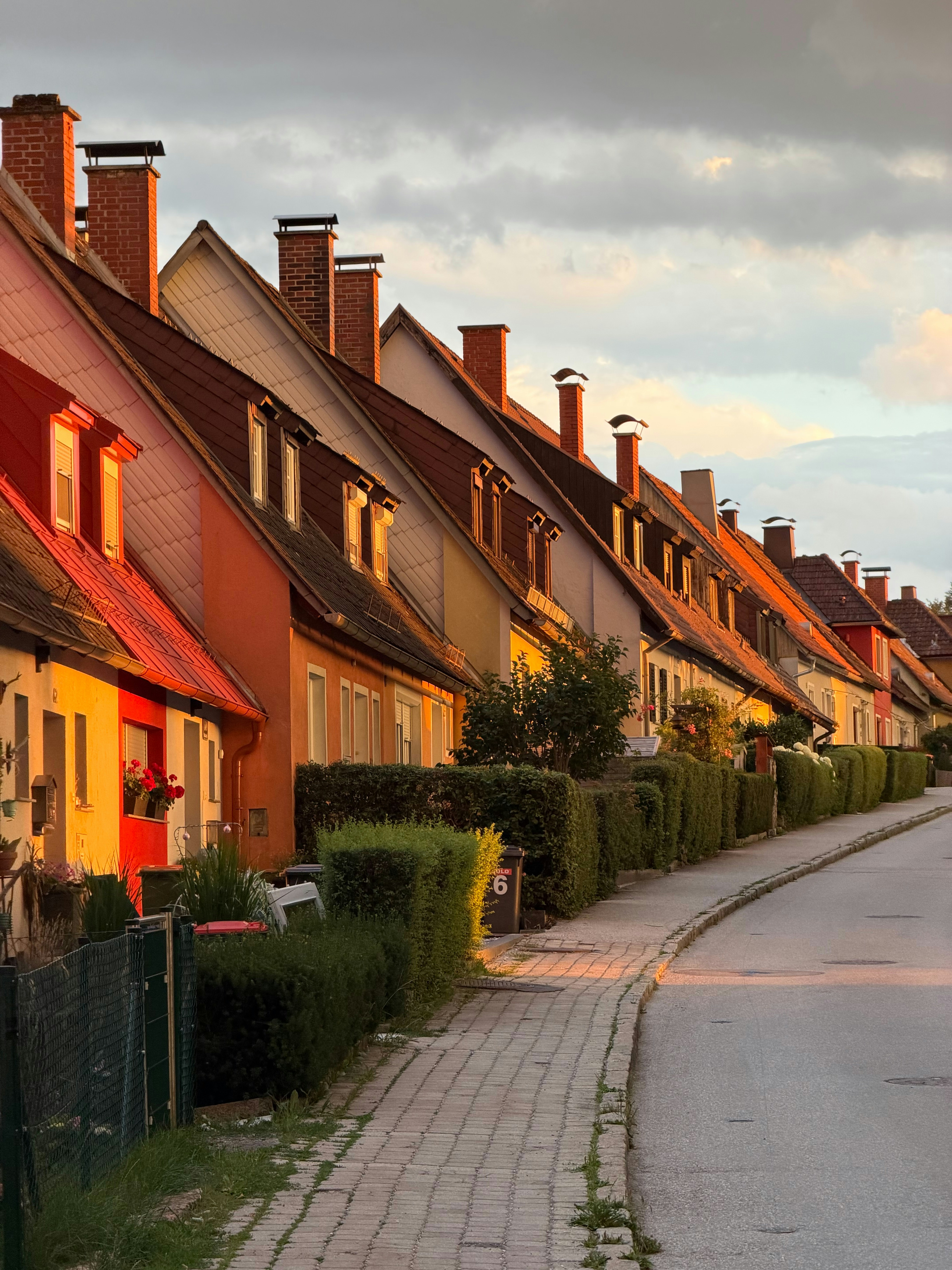 Sunlit Row: Evening Glow on a Polish-Like Street