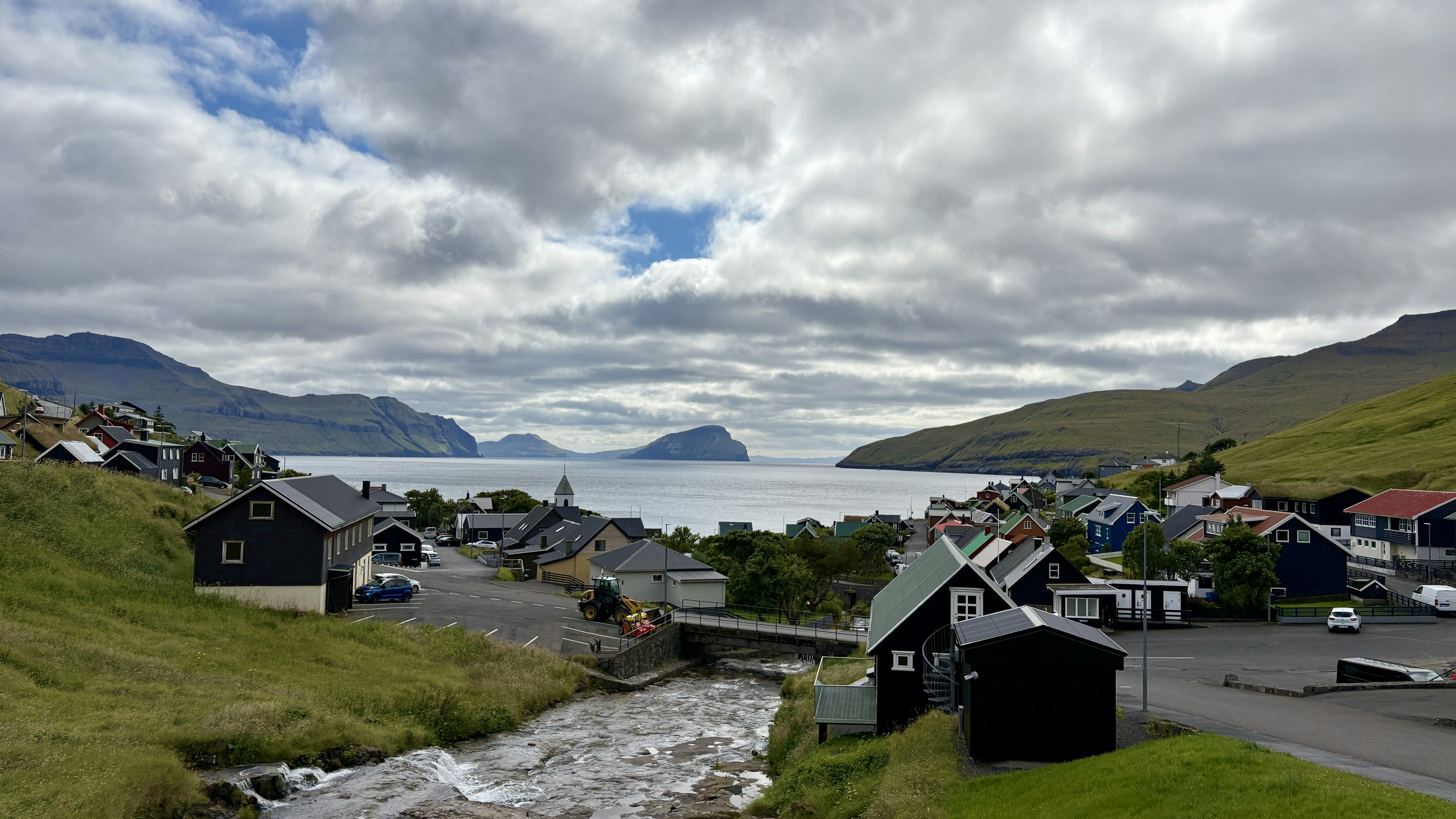 Harbor Village Beneath Rolling Clouds