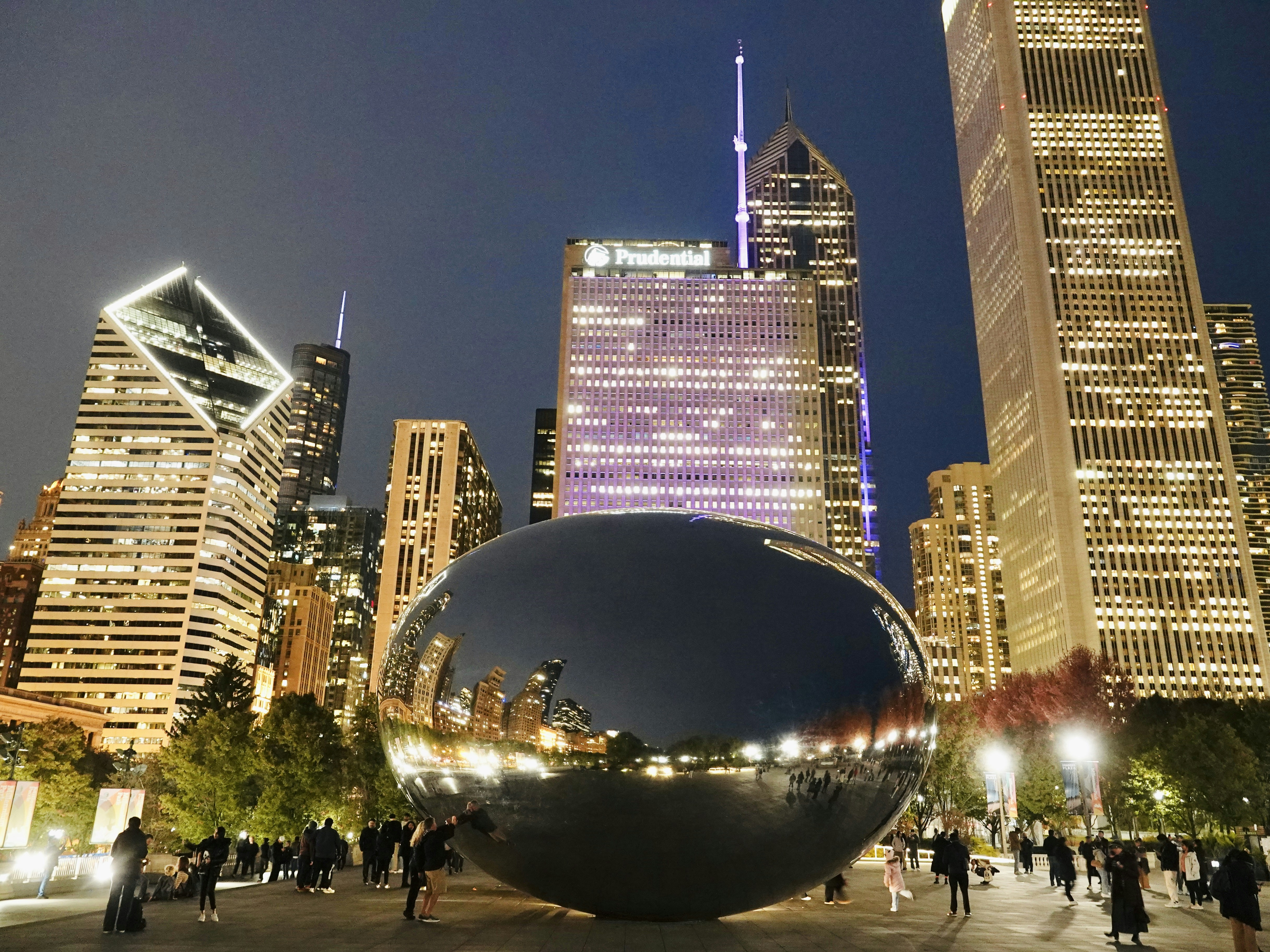 Skyline Reflections: The Cloud Gate Lens in City Night