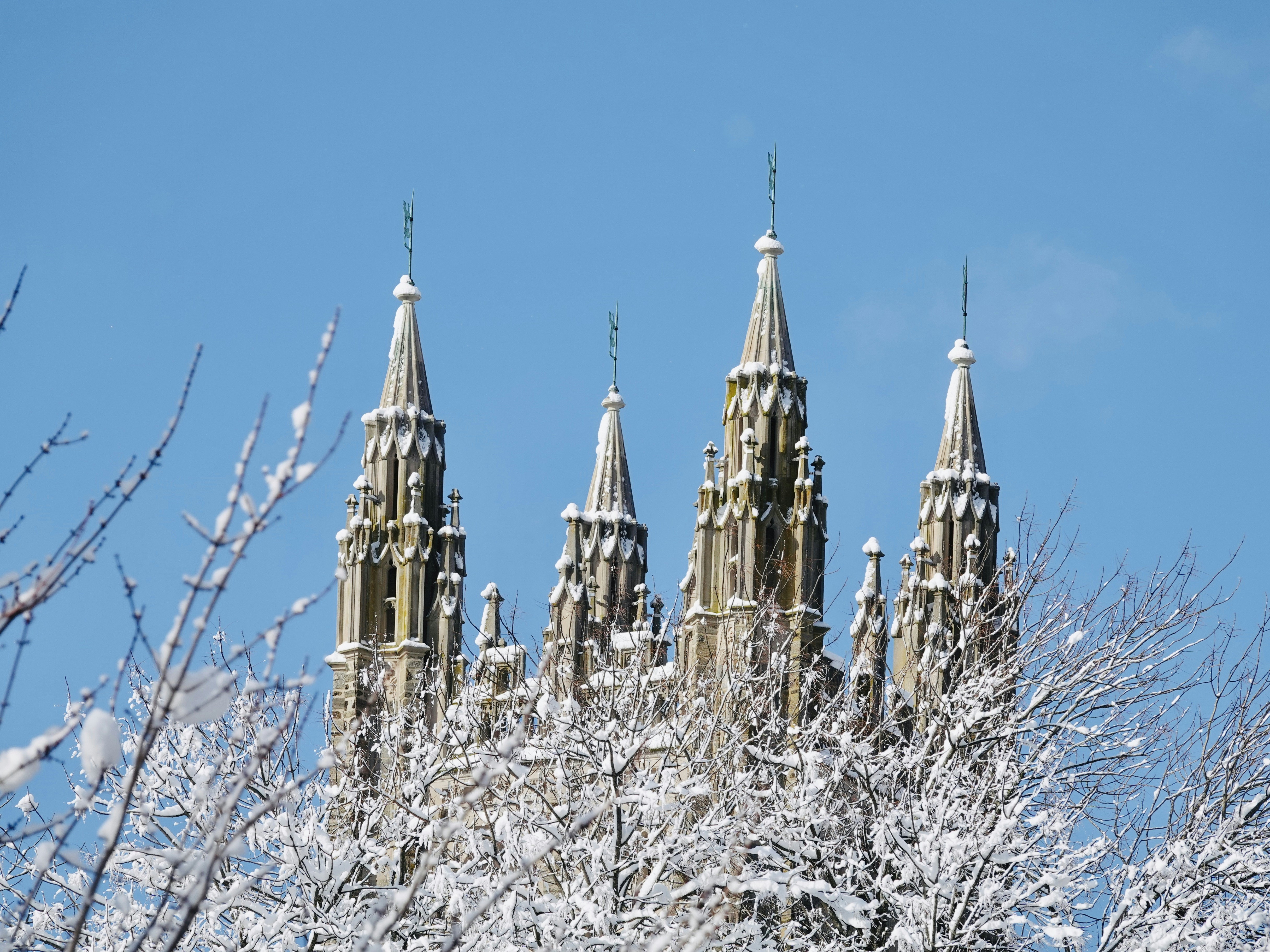 Gothic Peaks Above Snow: Cathedral Spires Against a Clear Sky