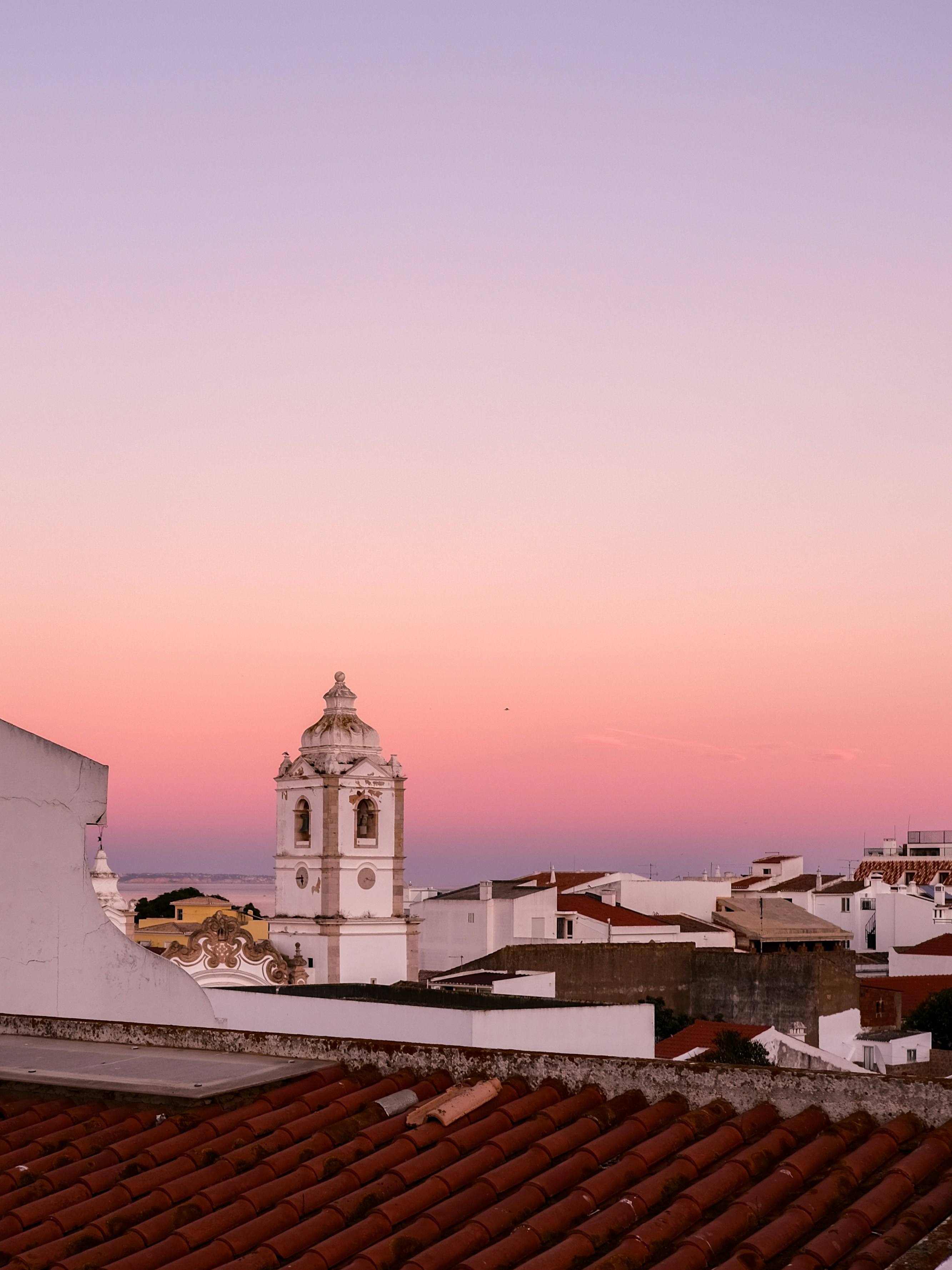 Pastel Heights: A Quiet Clerestory Over the Rooftops at Dusk