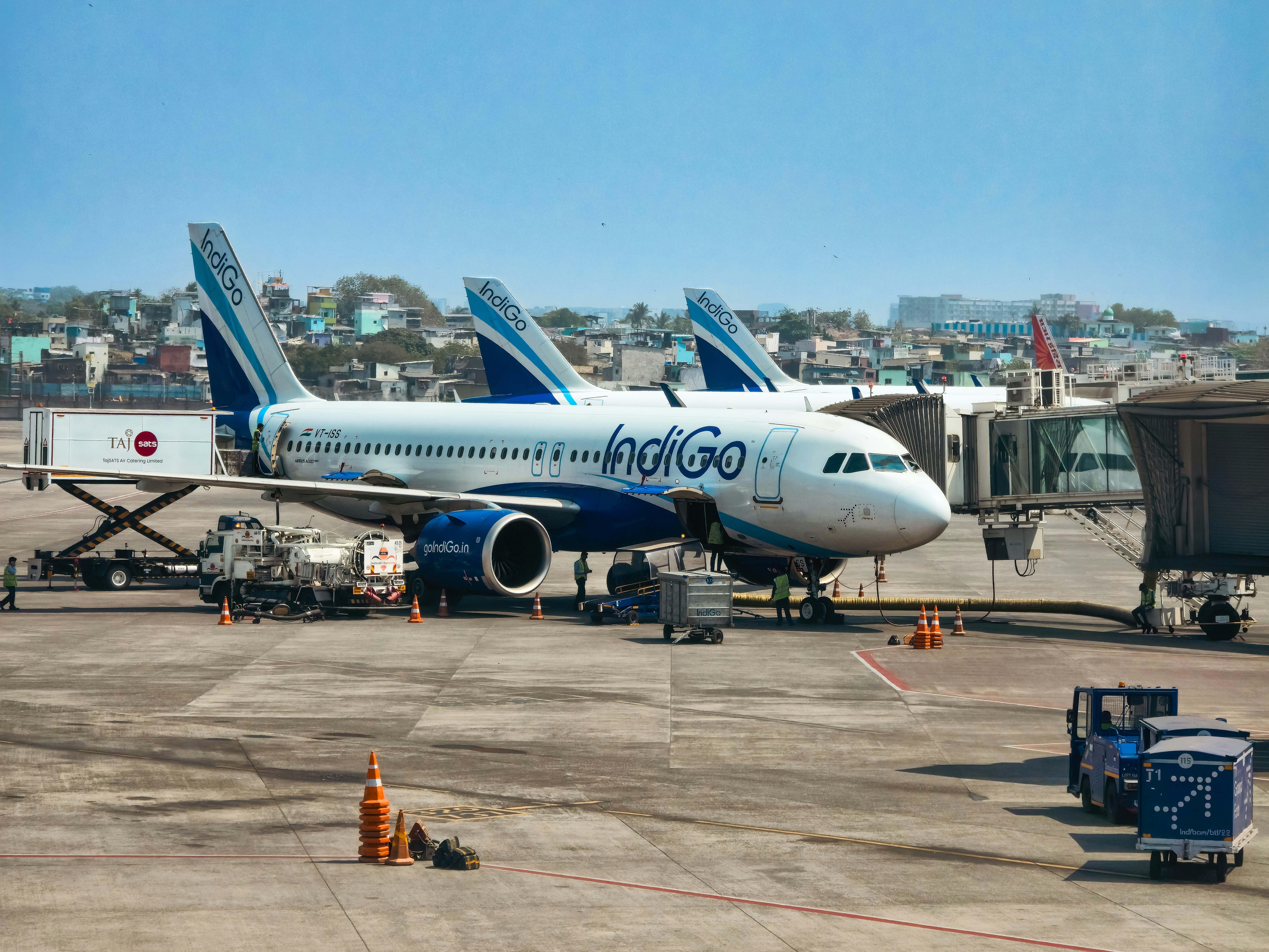 Grounded in Cyan: A NexaJet at Gate Gloomy Pier