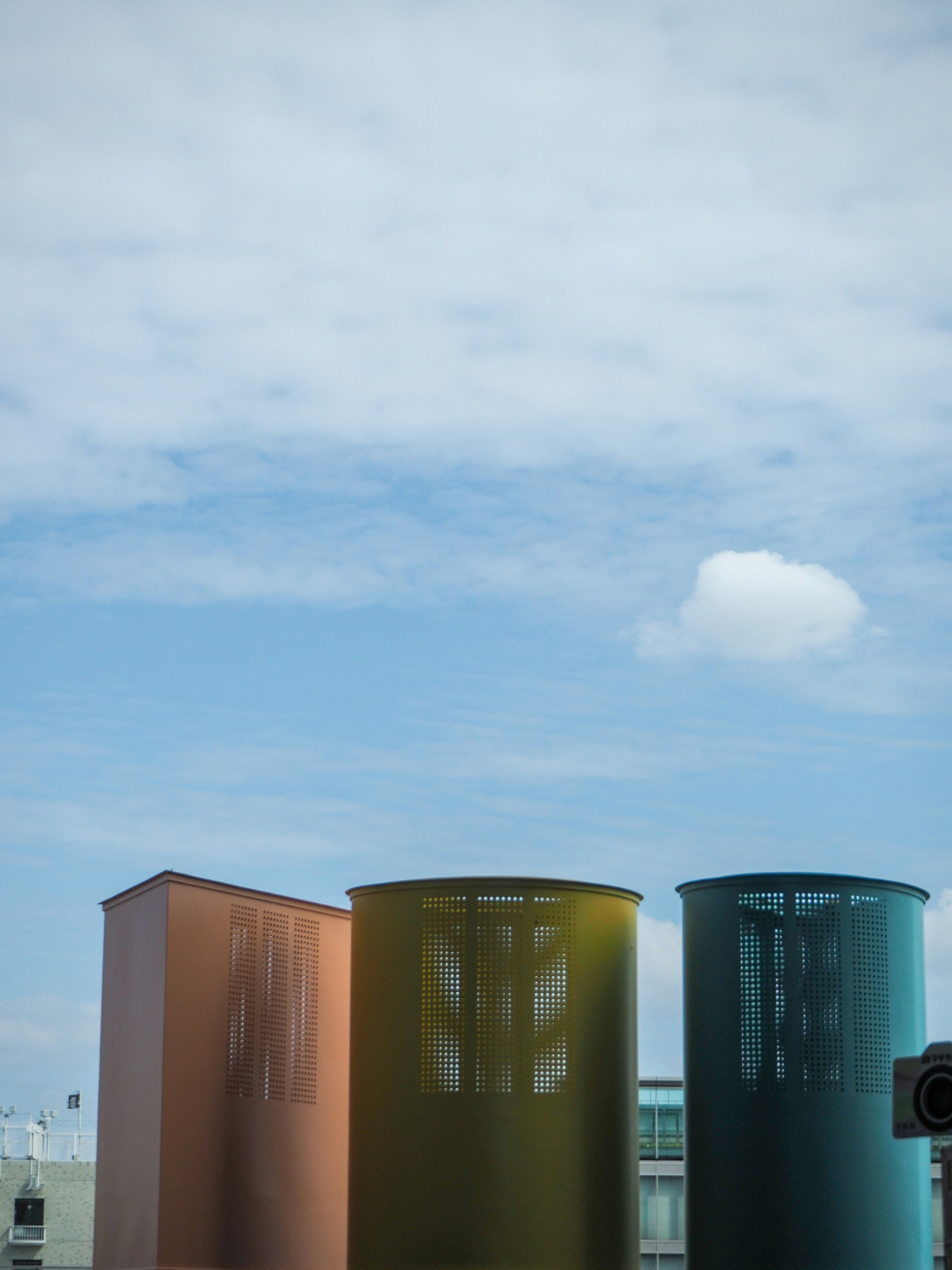 Vibrant industrial towers under a crisp blue sky