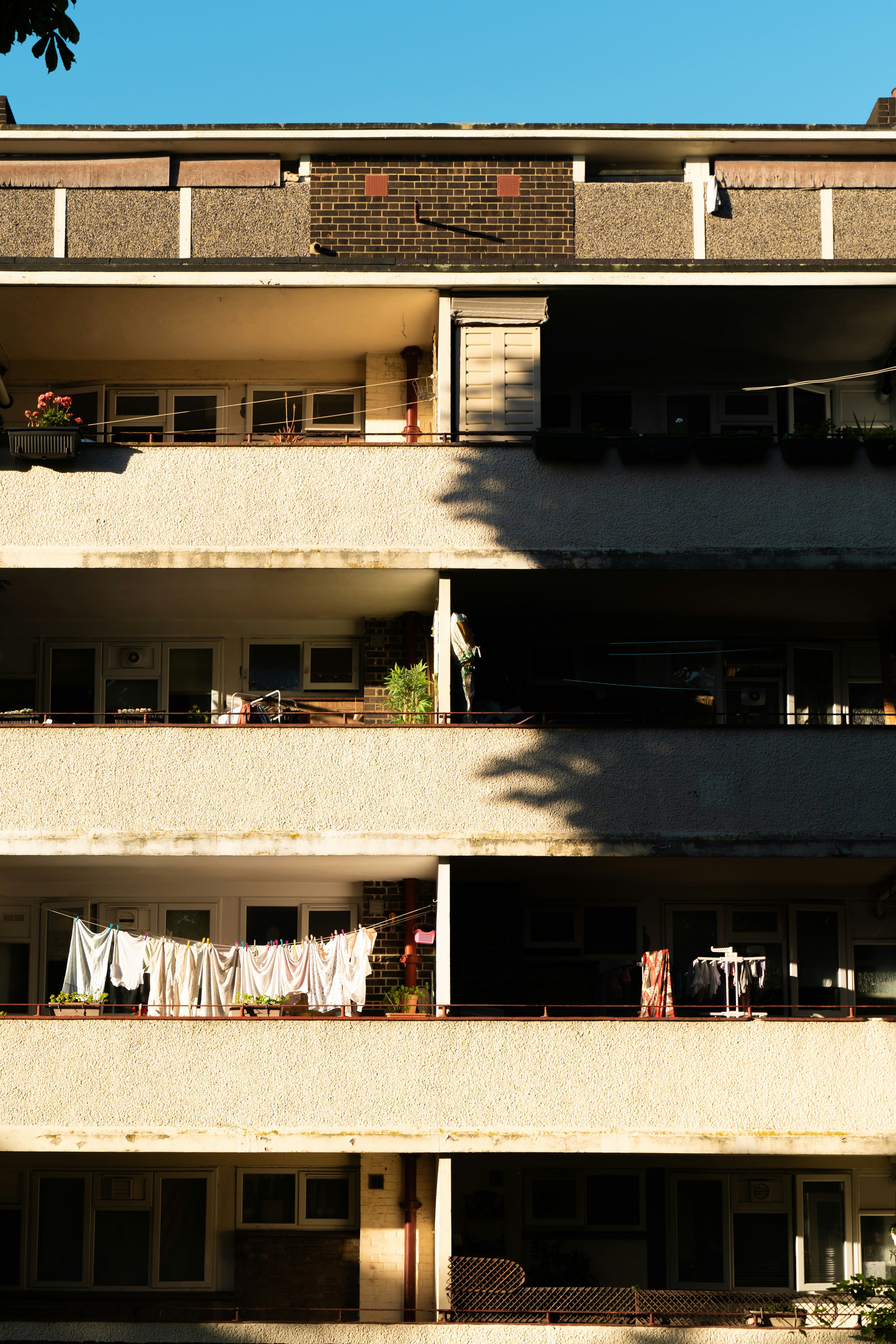 Sunlit Echoes: Balcony Lineage on a Quiet Apartment Block