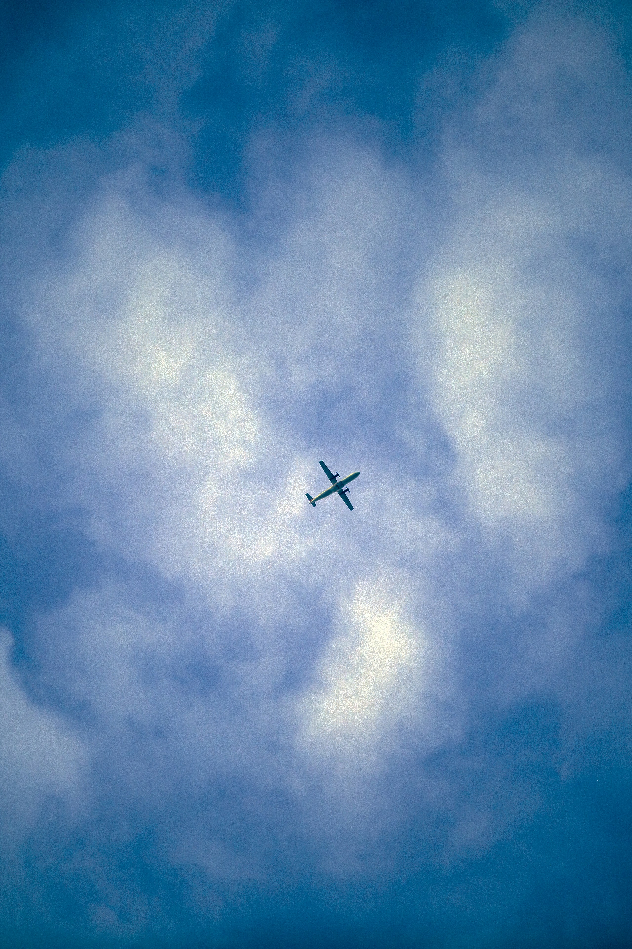Isolated Plane Crossing a Quiet Sky