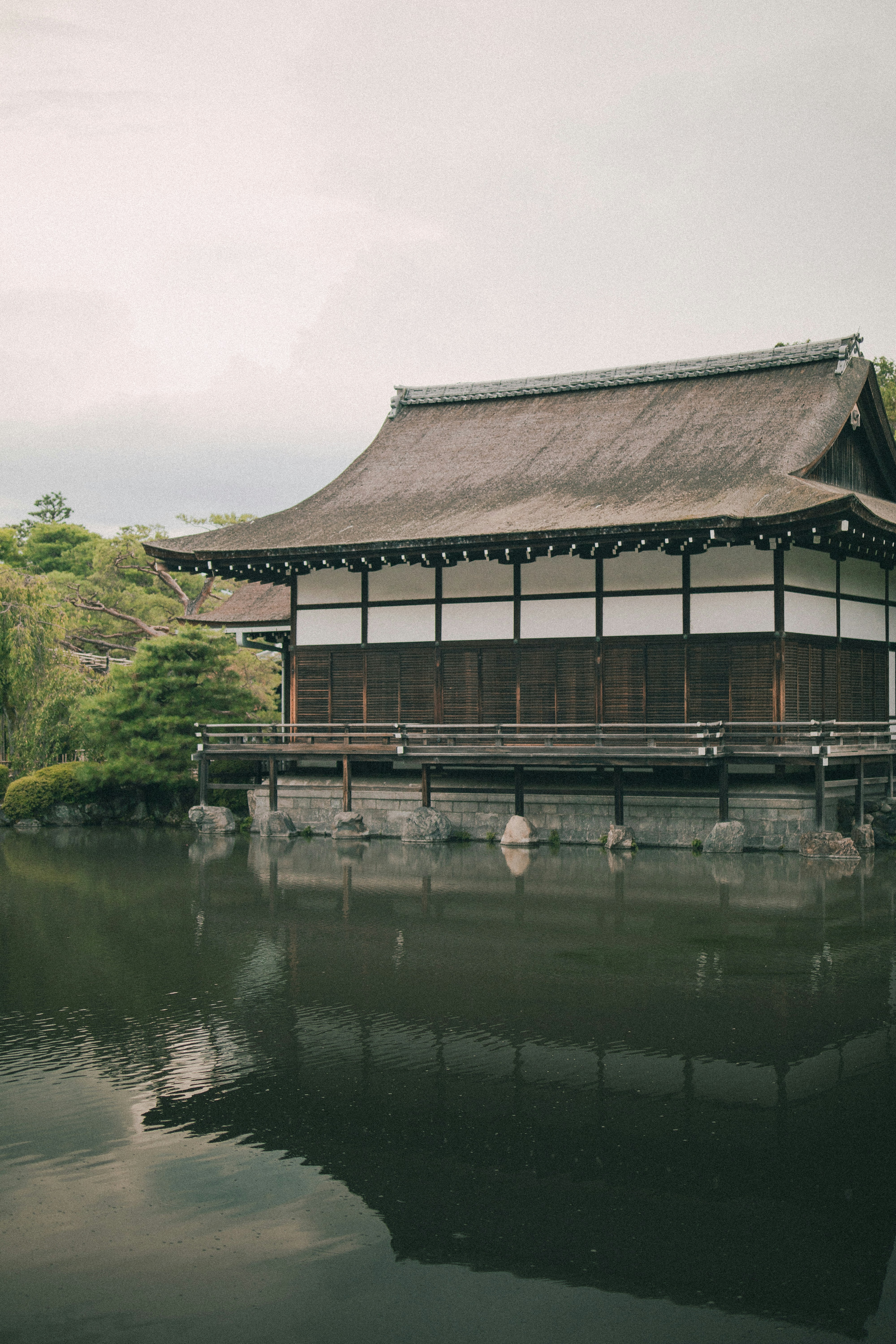 Reflected Serenity: A Traditional Japanese Pavilion by the Water