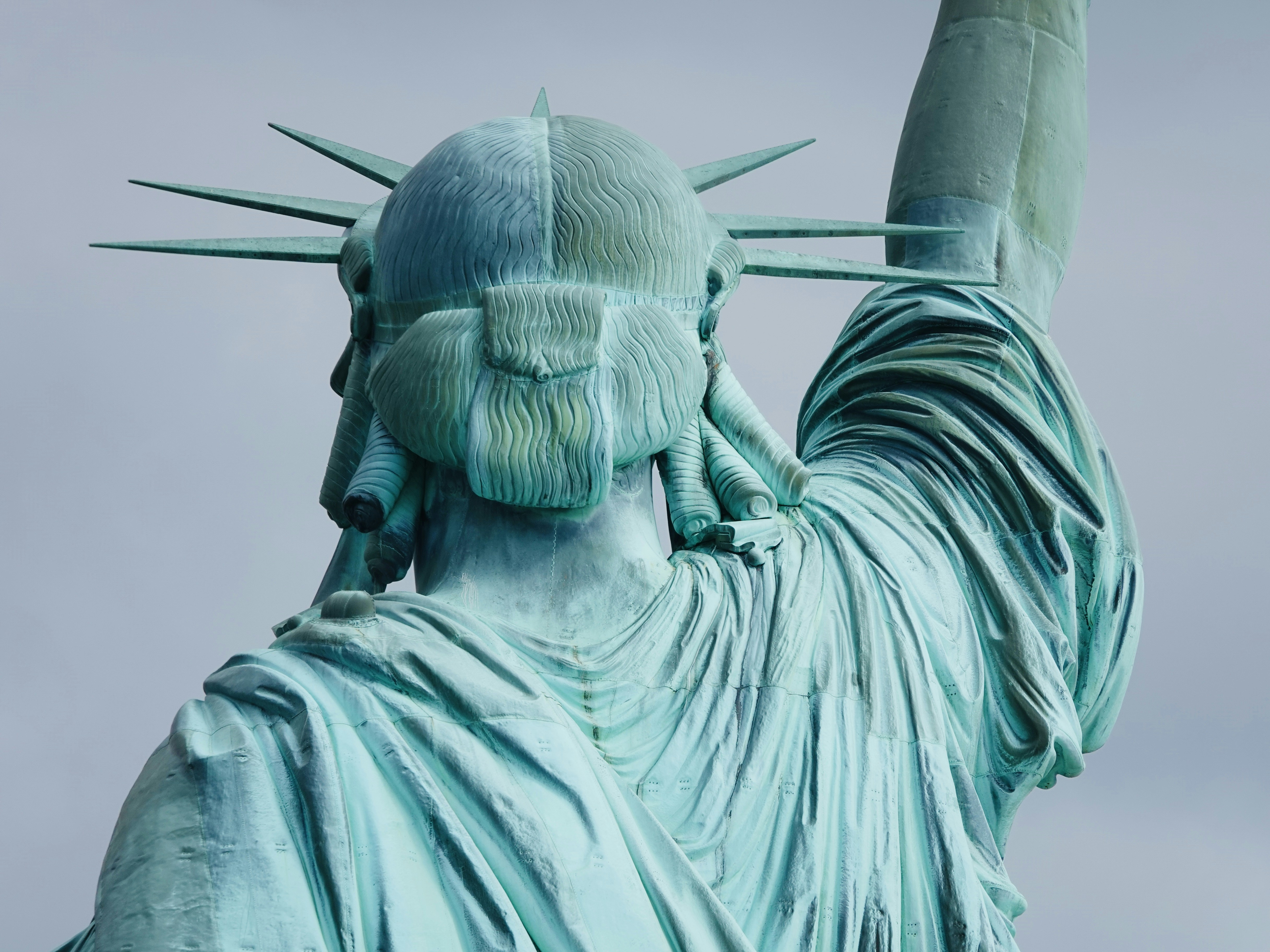 Patina of Liberty: Close-Up of the Crowned Torch and Spikes