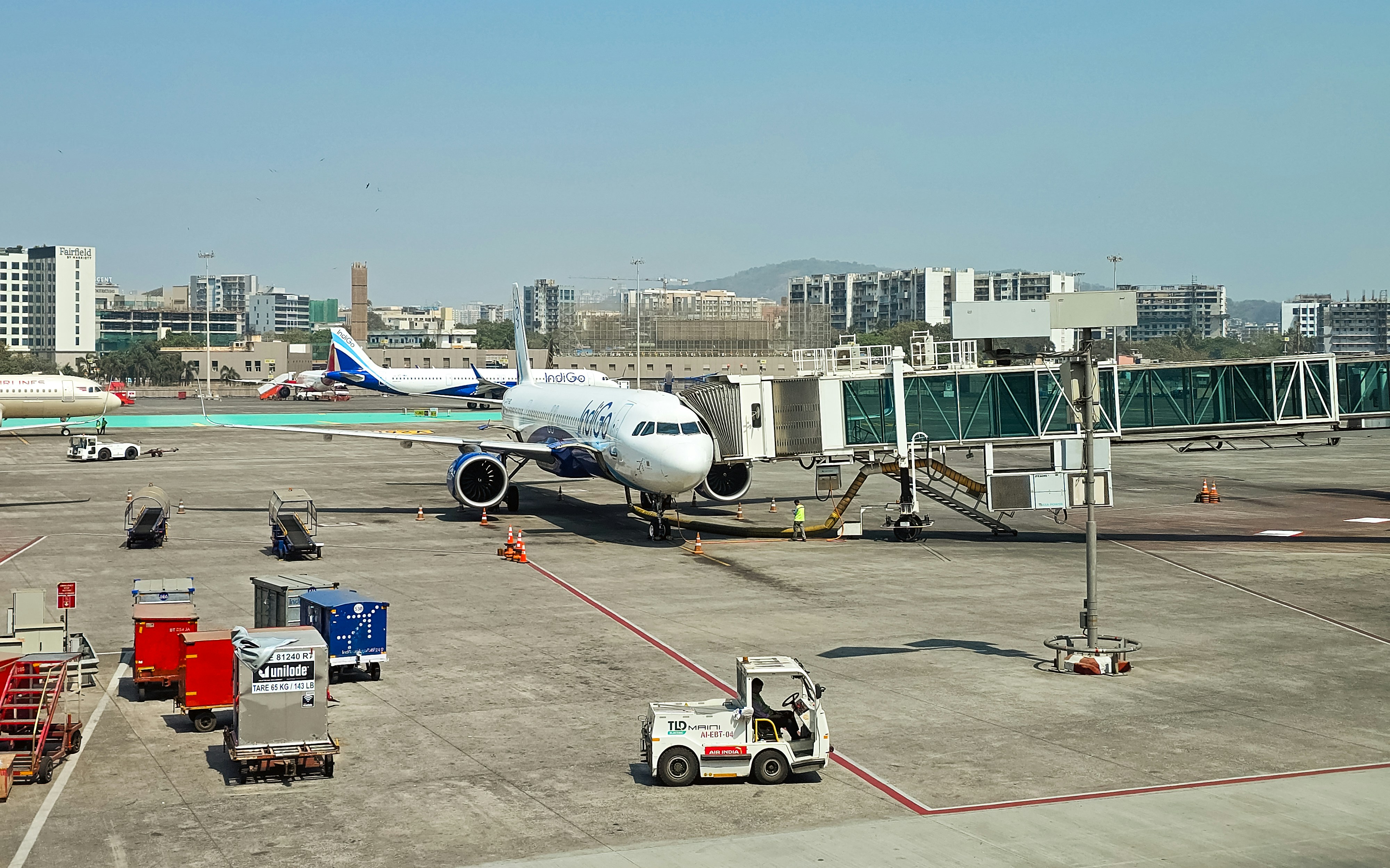 Jet at Gate: A Quiet Tarmac Moment Beneath morning Light