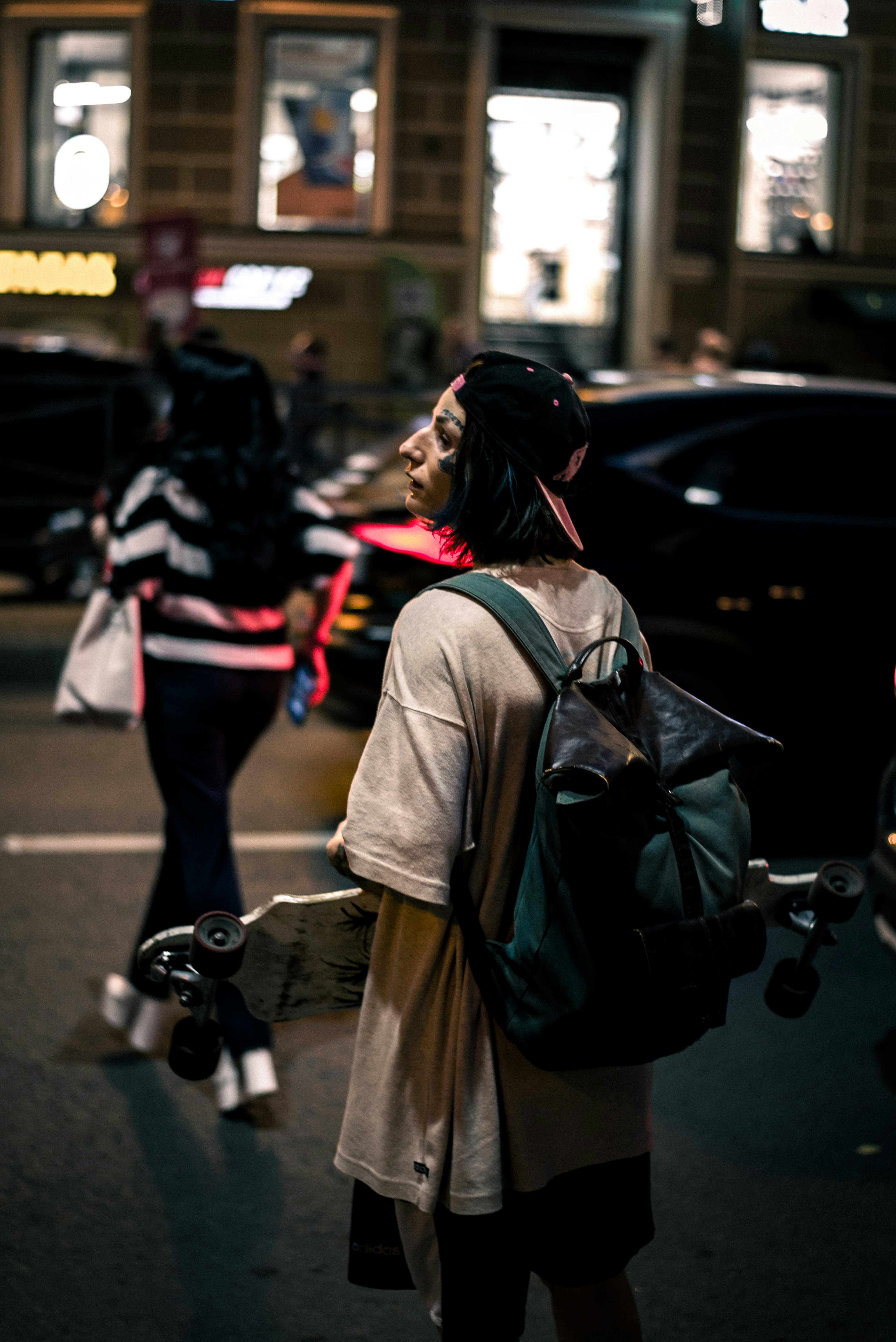 City Night Runner: A Brand-Backpacker Stares Ahead
