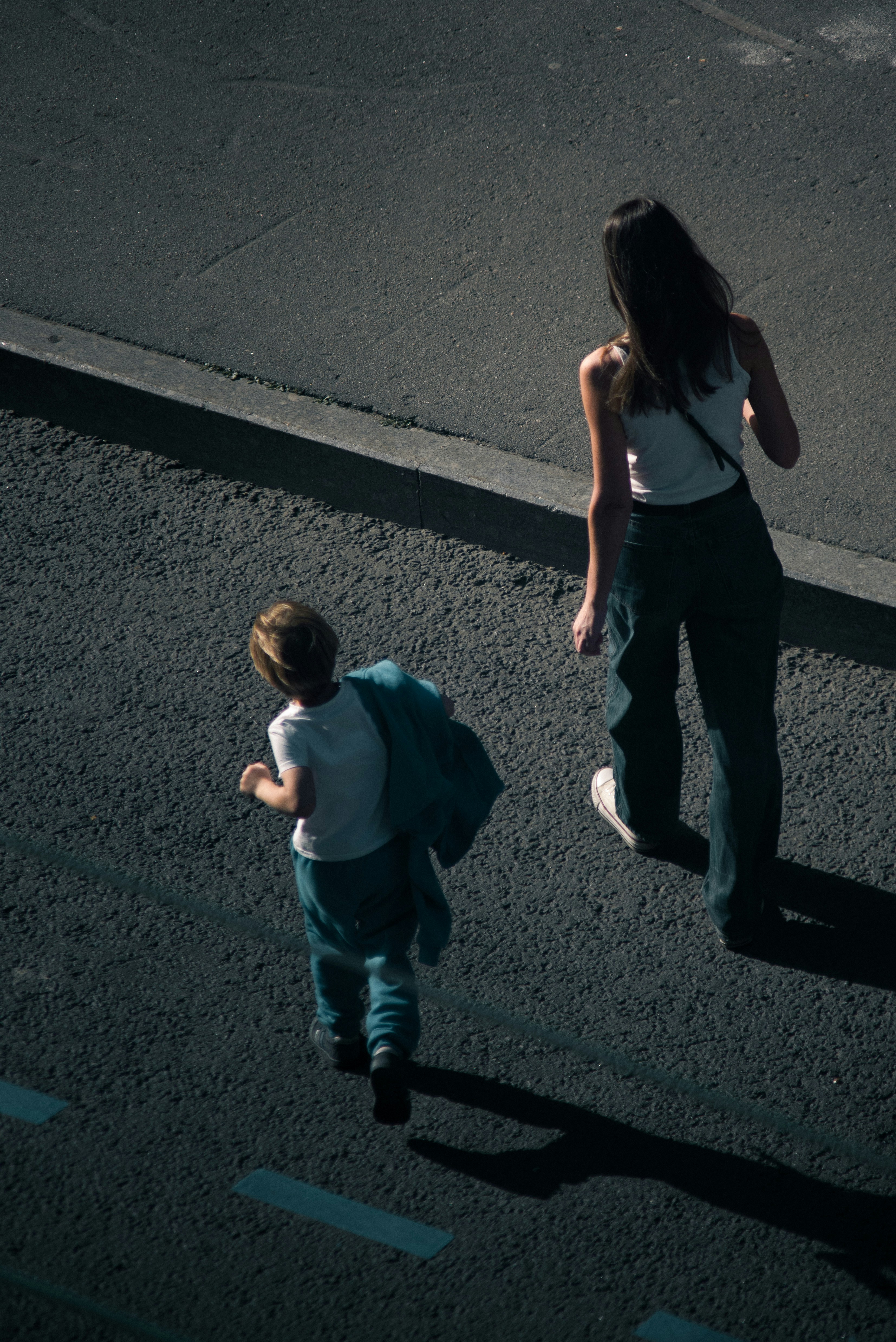 Two Figures on a Sunlit Walk: Aerial Perspective of Movement