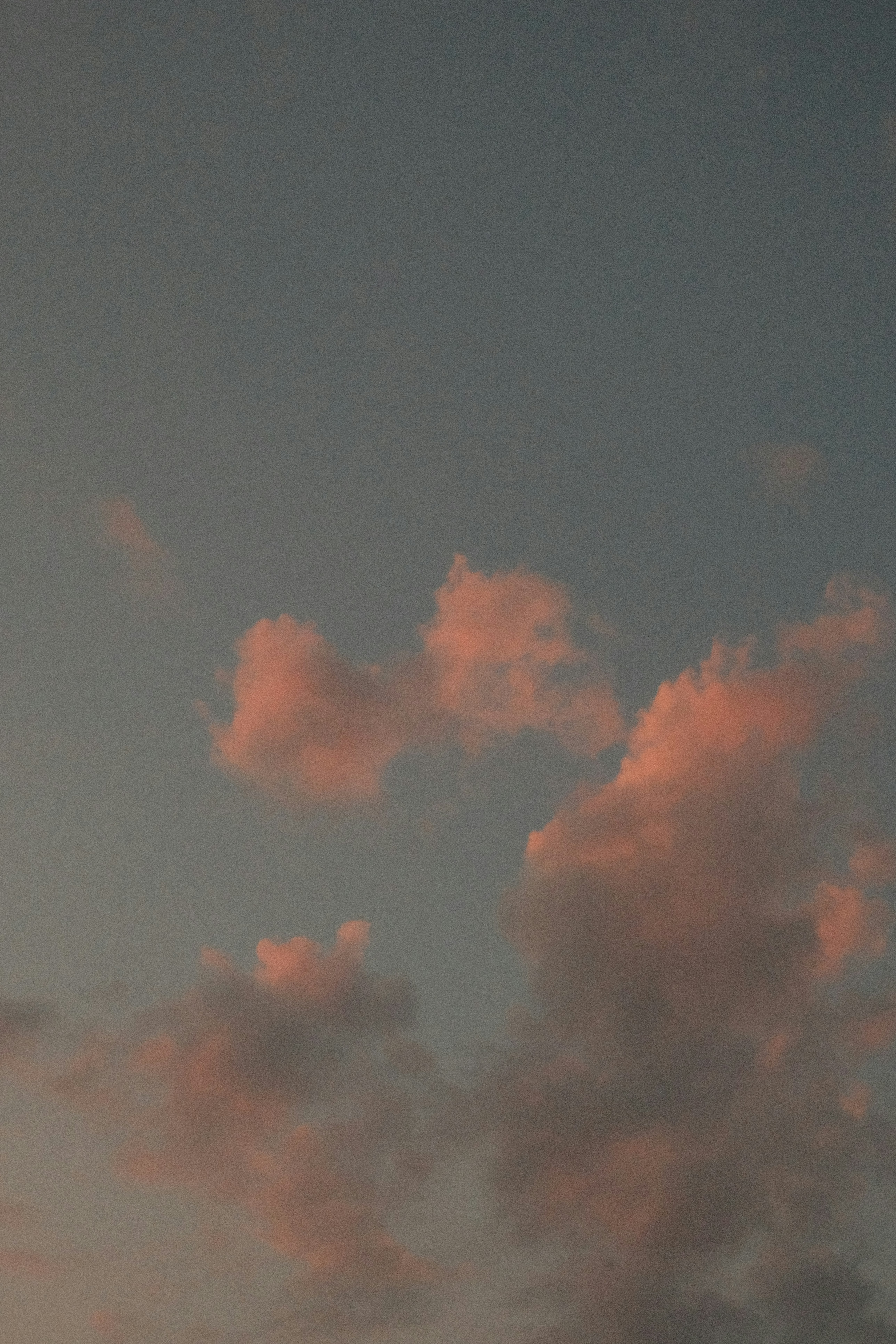 Soft Evening Clouds Cast in Pink-Orange Light
