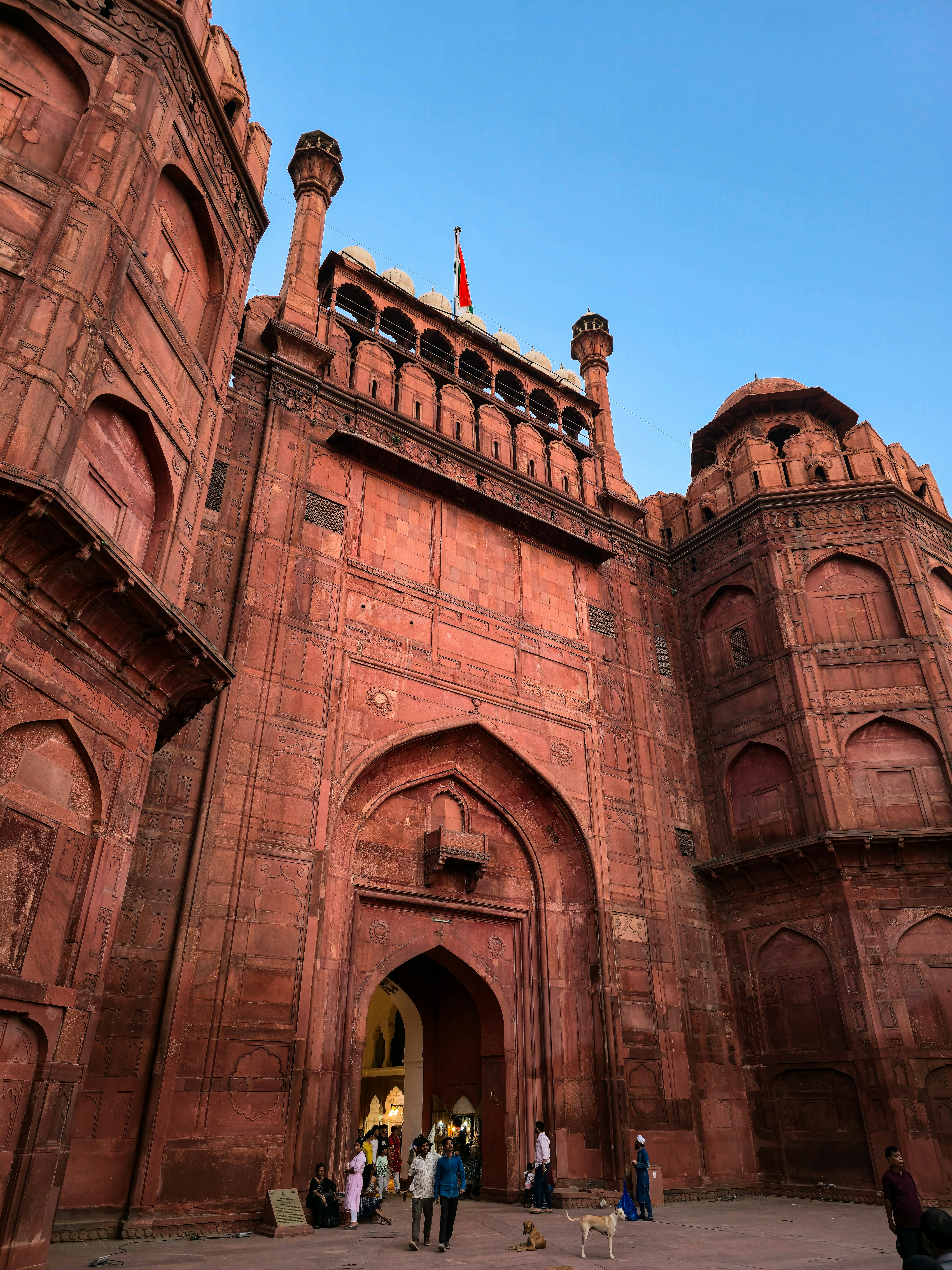 Gatehouse at Amber Fort: A Sunlit Red Fortress Stands Against a Clear Sky