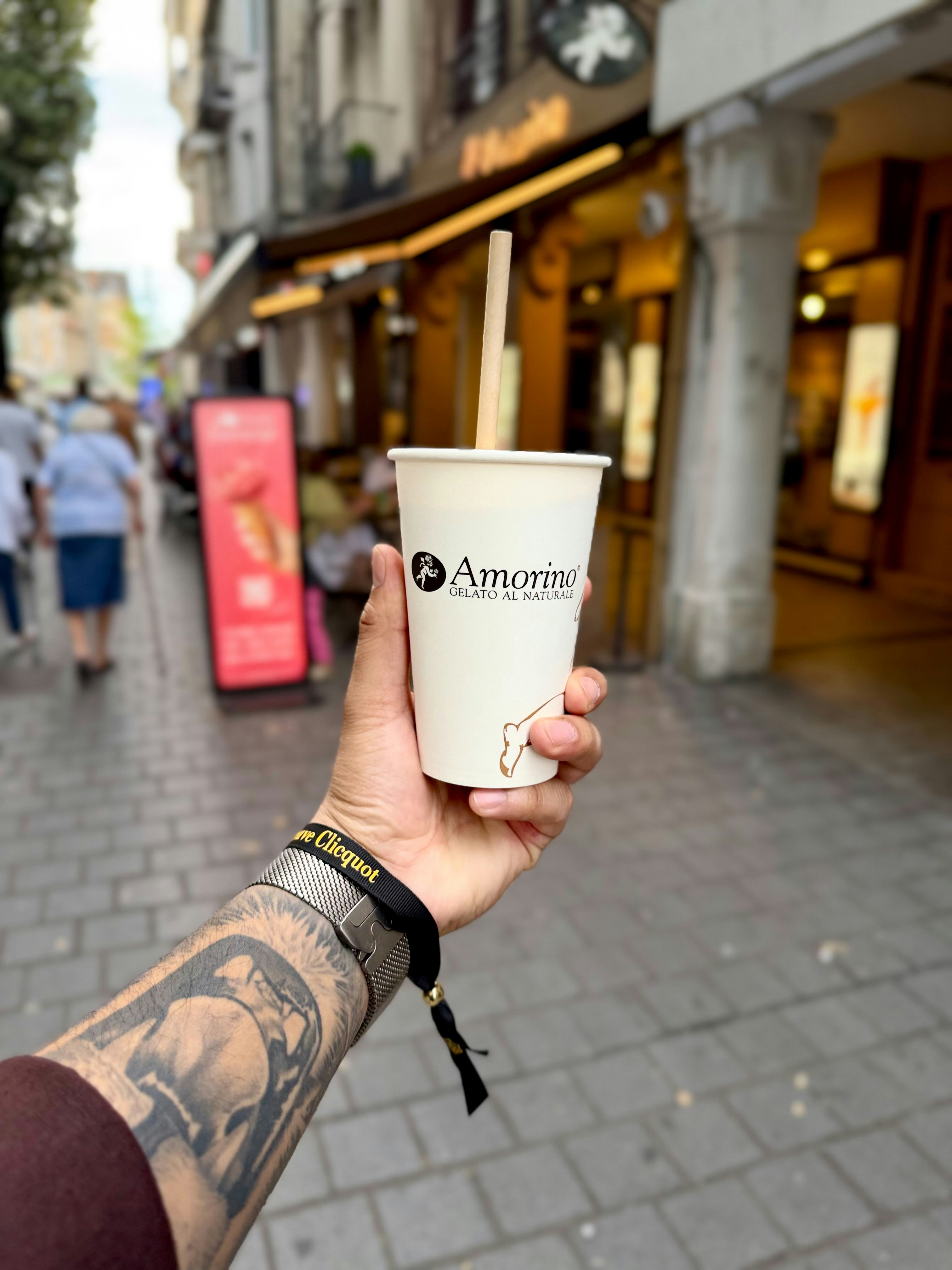 Handheld Cup of Street Coffee: A Moment in Motion