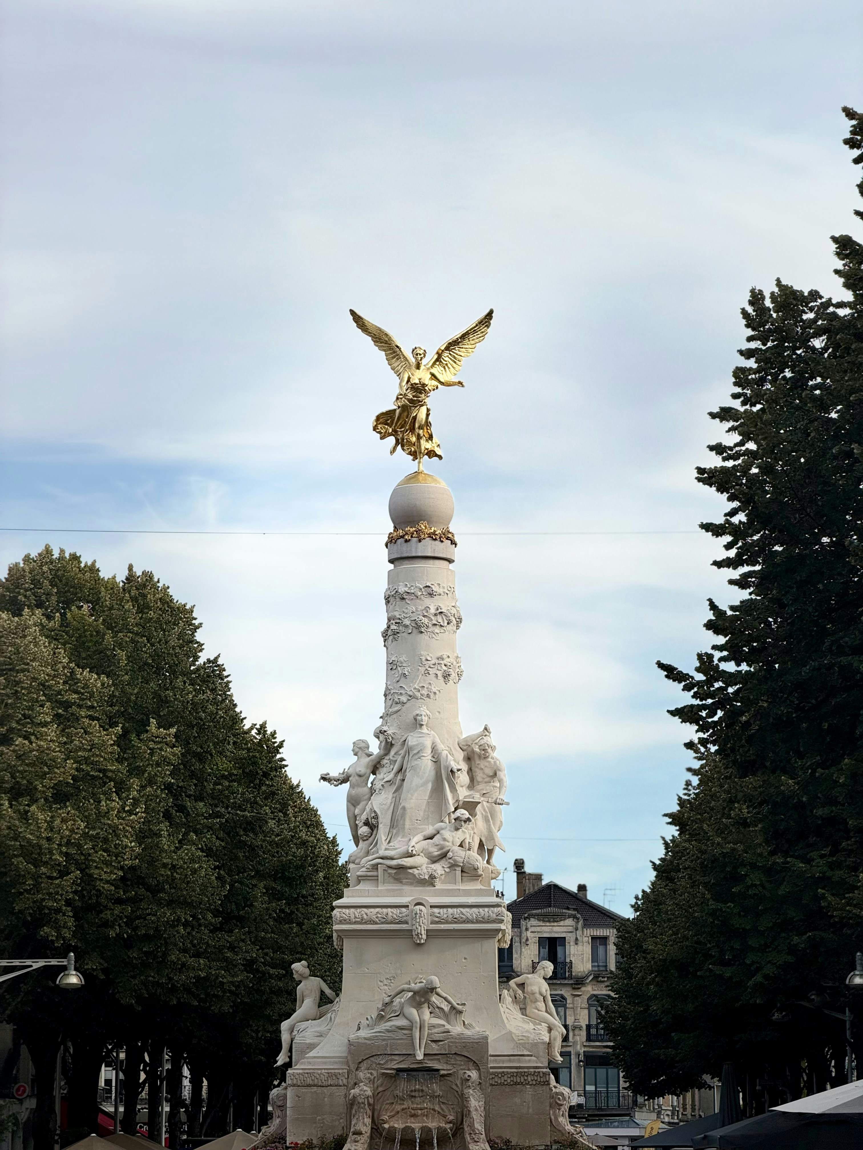 Golden Angel Above the Marble Monument