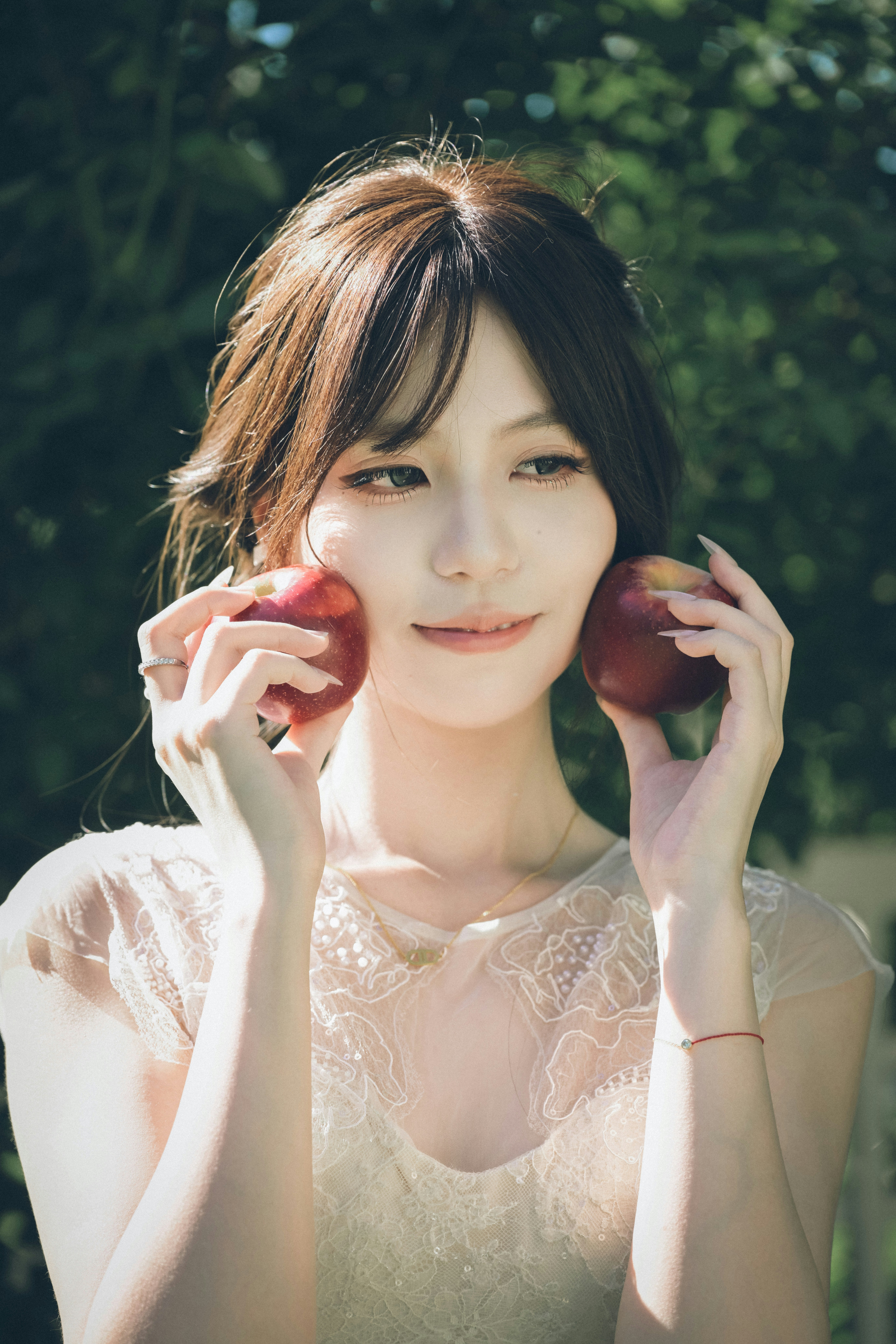 Soft Sunlit Grace: A Portrait with Apples in Bloom