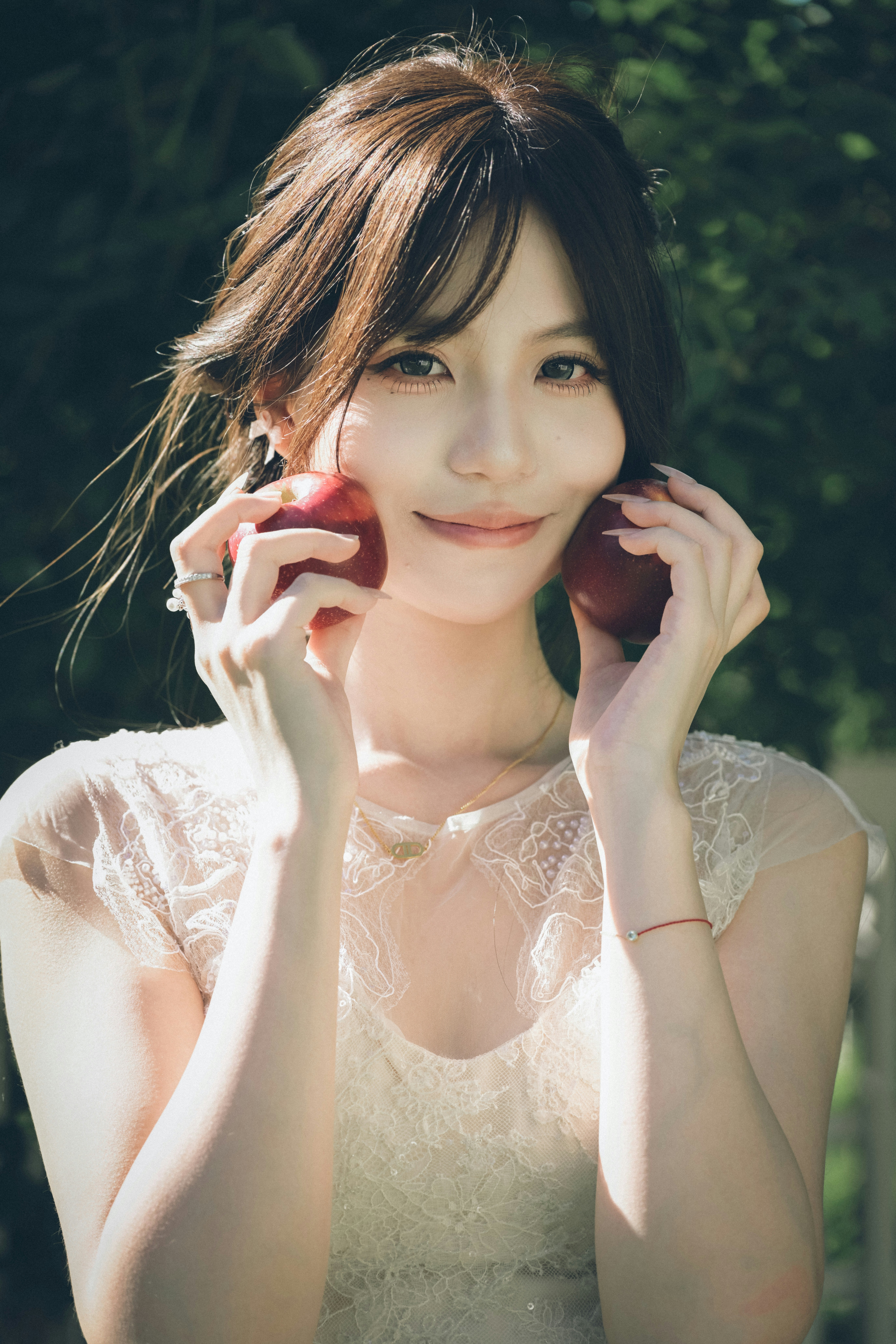 Portrait in Sunlit Orchard: Soft Smile with Red Apples