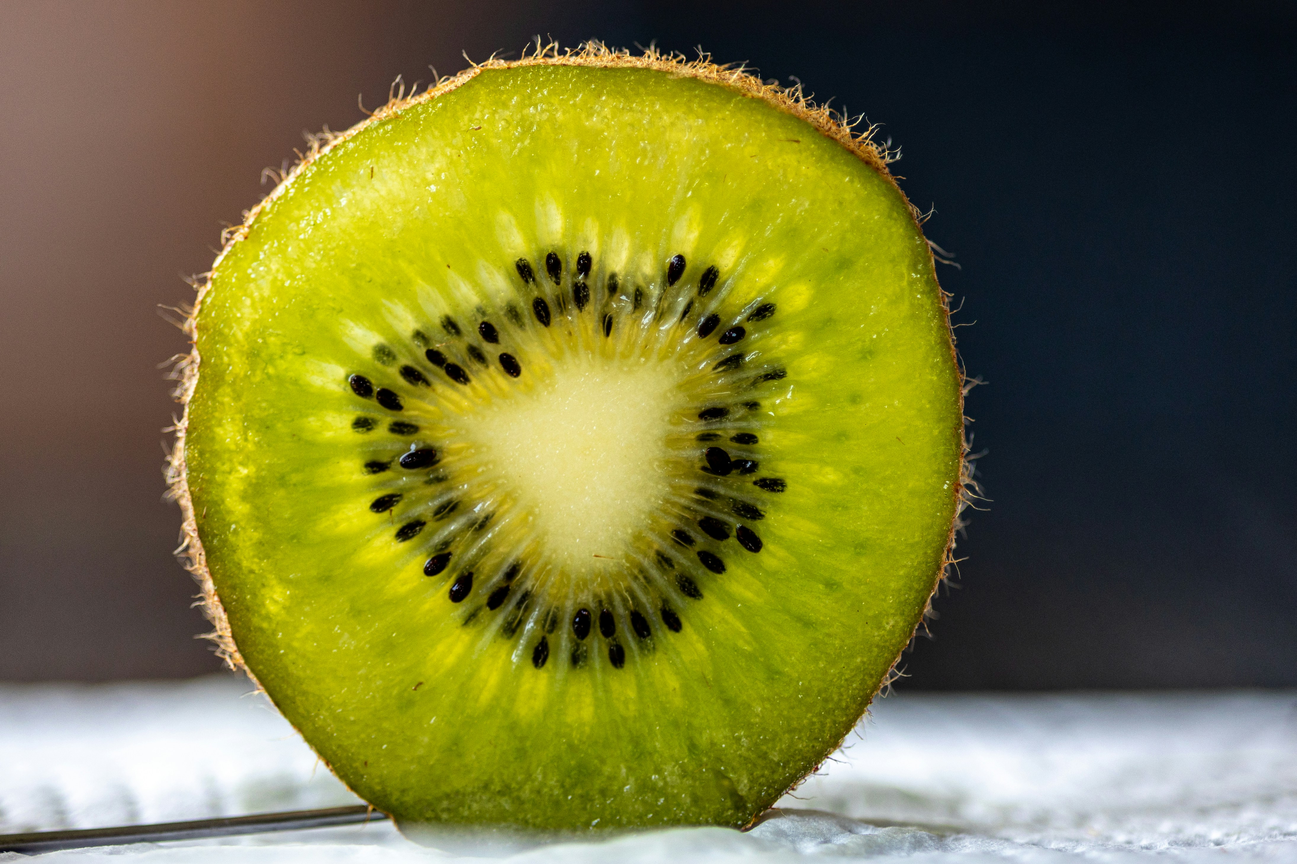 Kiwi Spotlight: a close-up on a sun-kissed kiwi slice